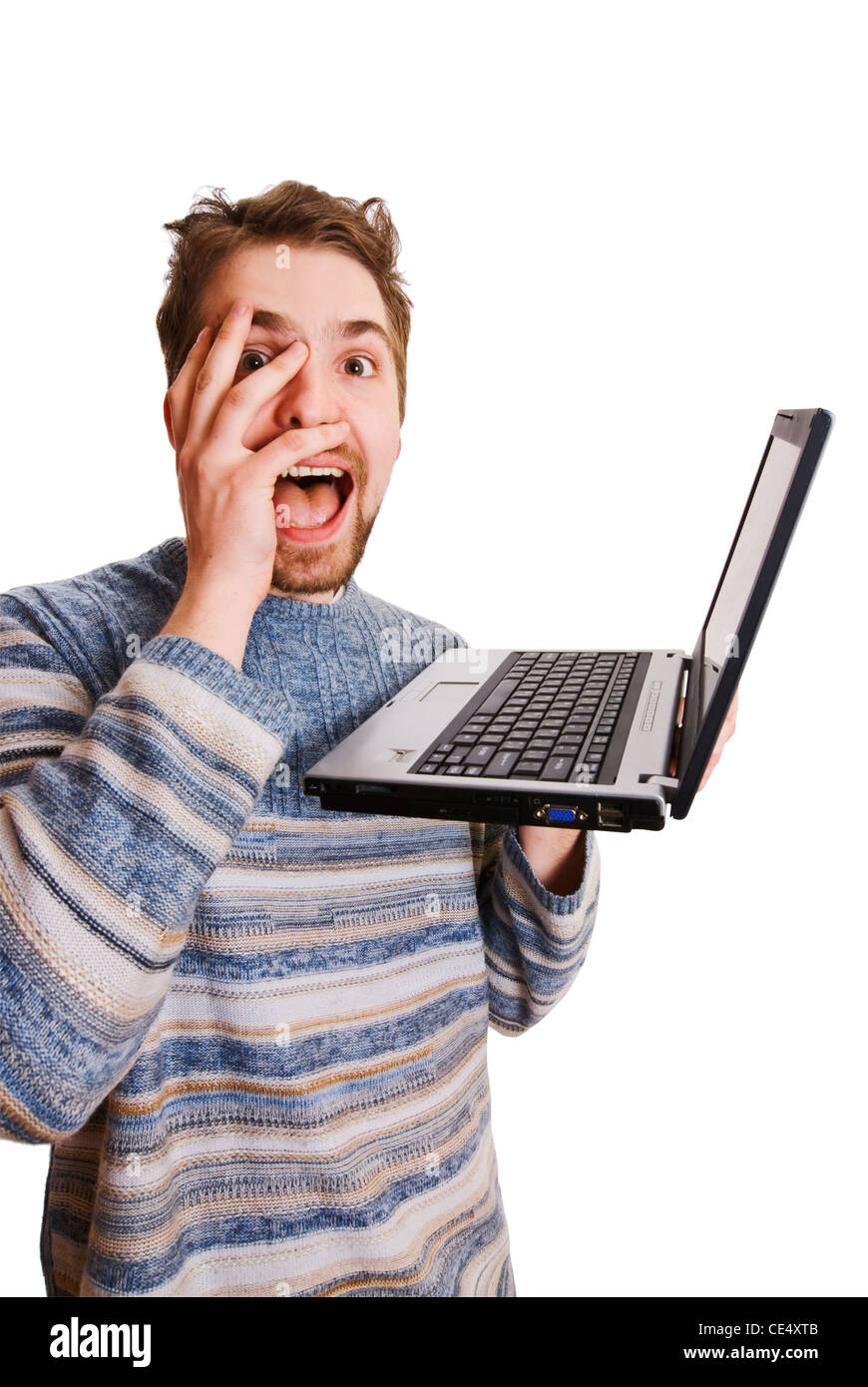 Young man with laptop looking very disappointed Stock Photo - Alamy