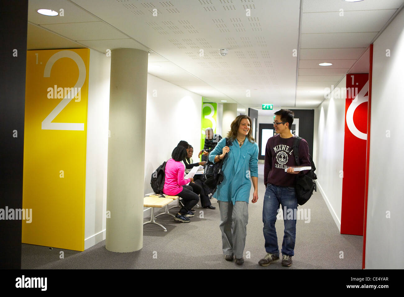 students in a university corridor Stock Photo - Alamy