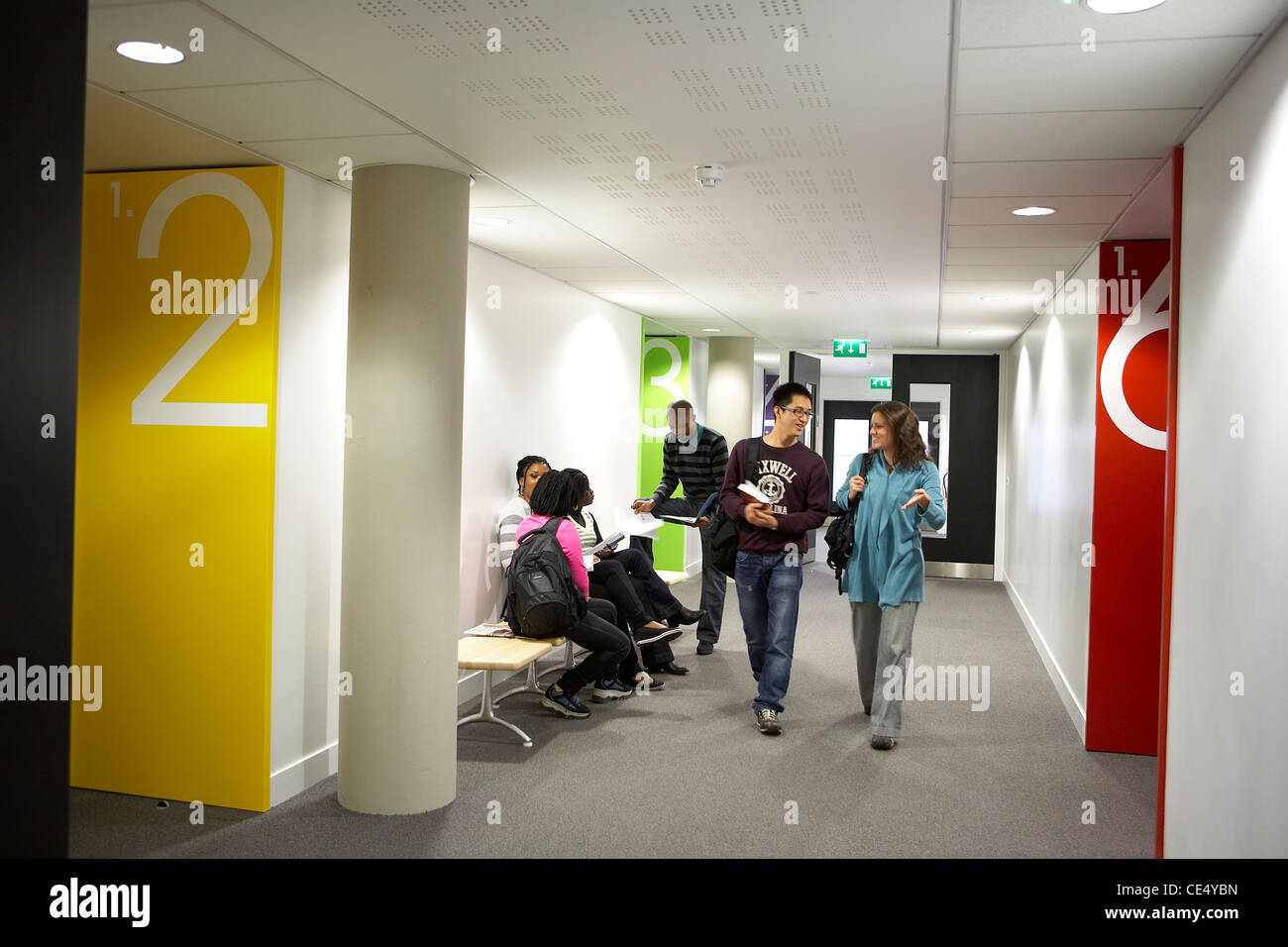 students in a university corridor Stock Photo - Alamy