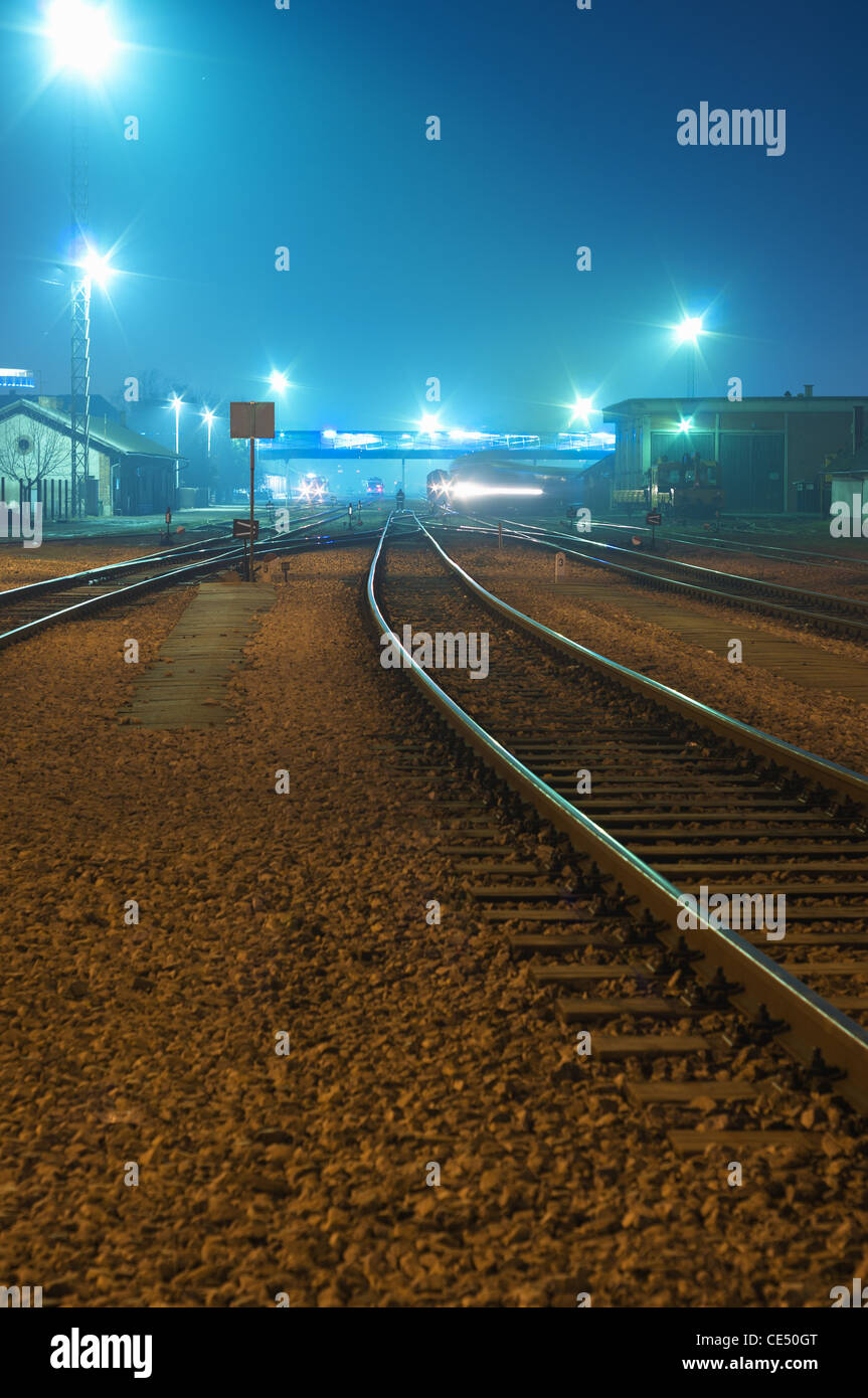 Railway at night Stock Photo - Alamy