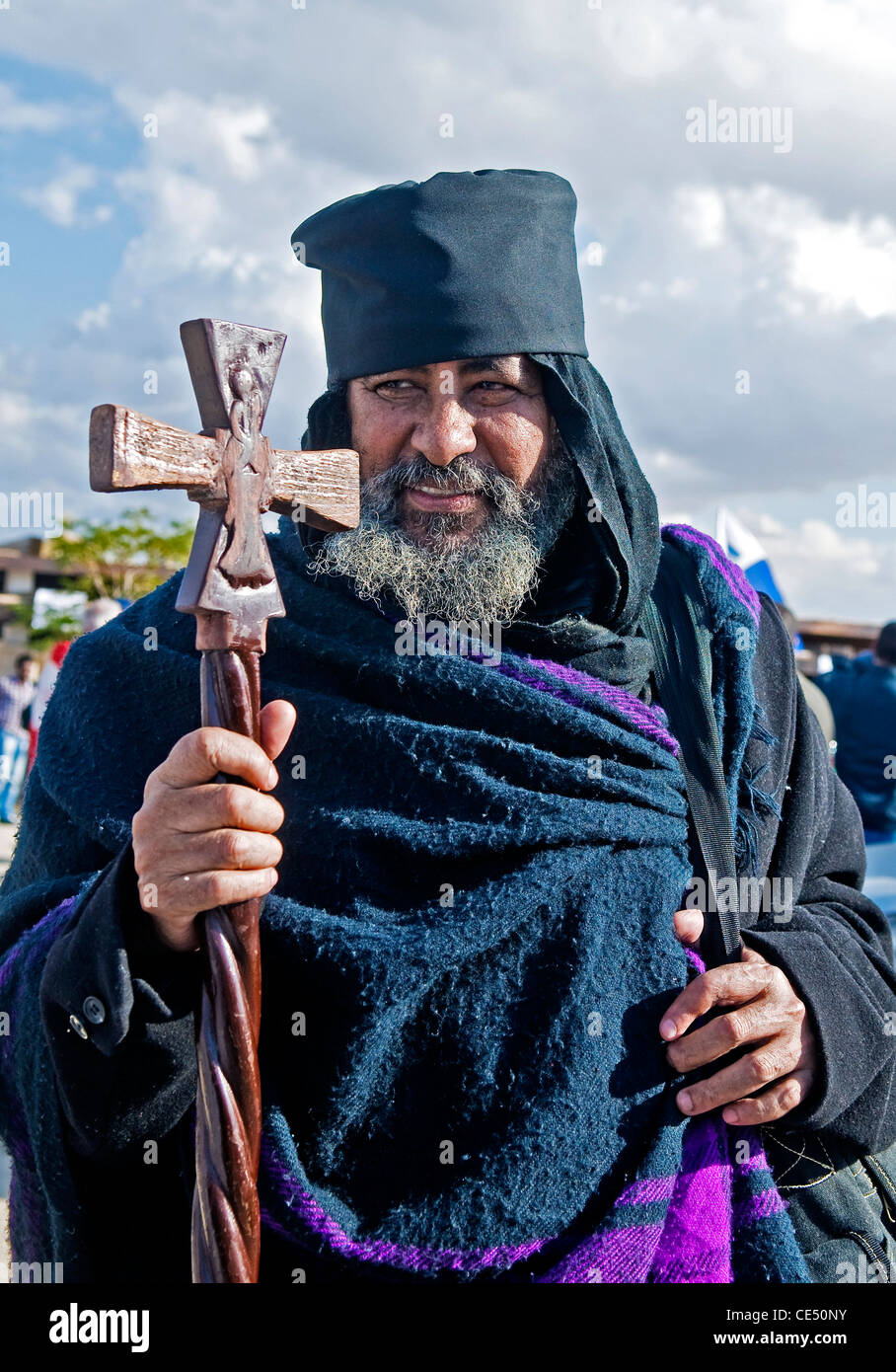 Ethiopian Orthodox priest participates in the annual baptising ceremony ...