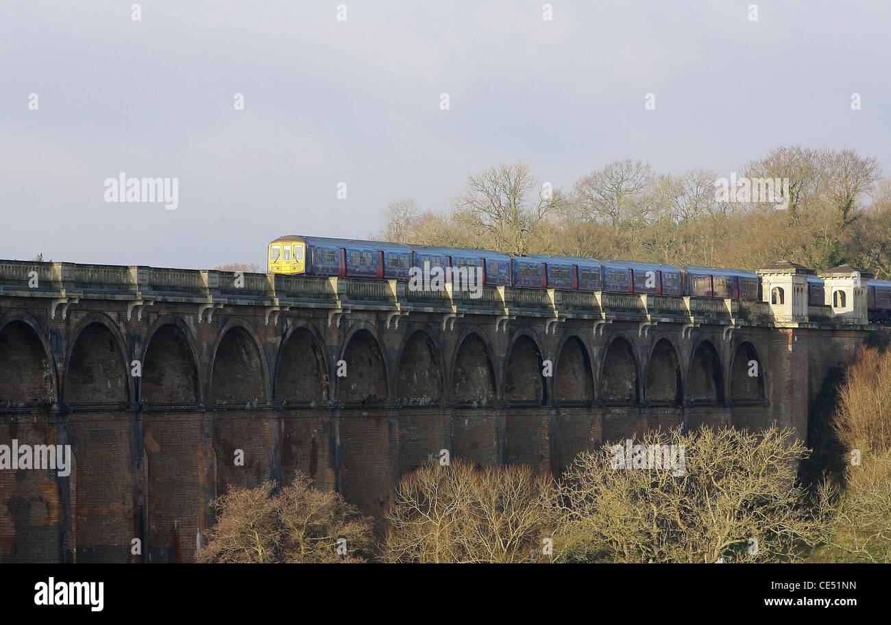A London to Brighton train travels over the Ouse Valley Viaduct ...