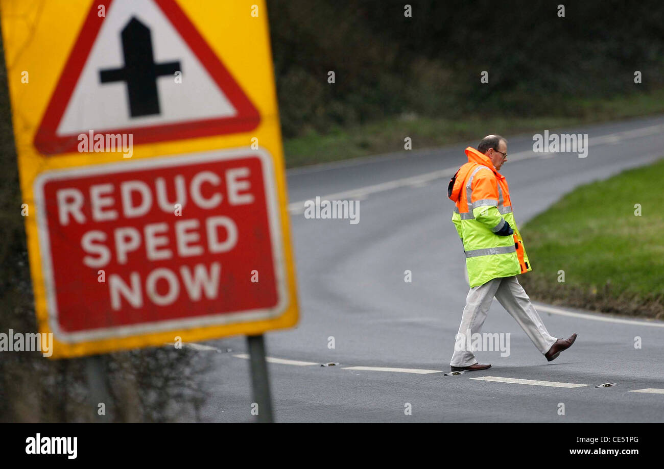 A road traffic investigator measures an area of road were a fatal Road ...