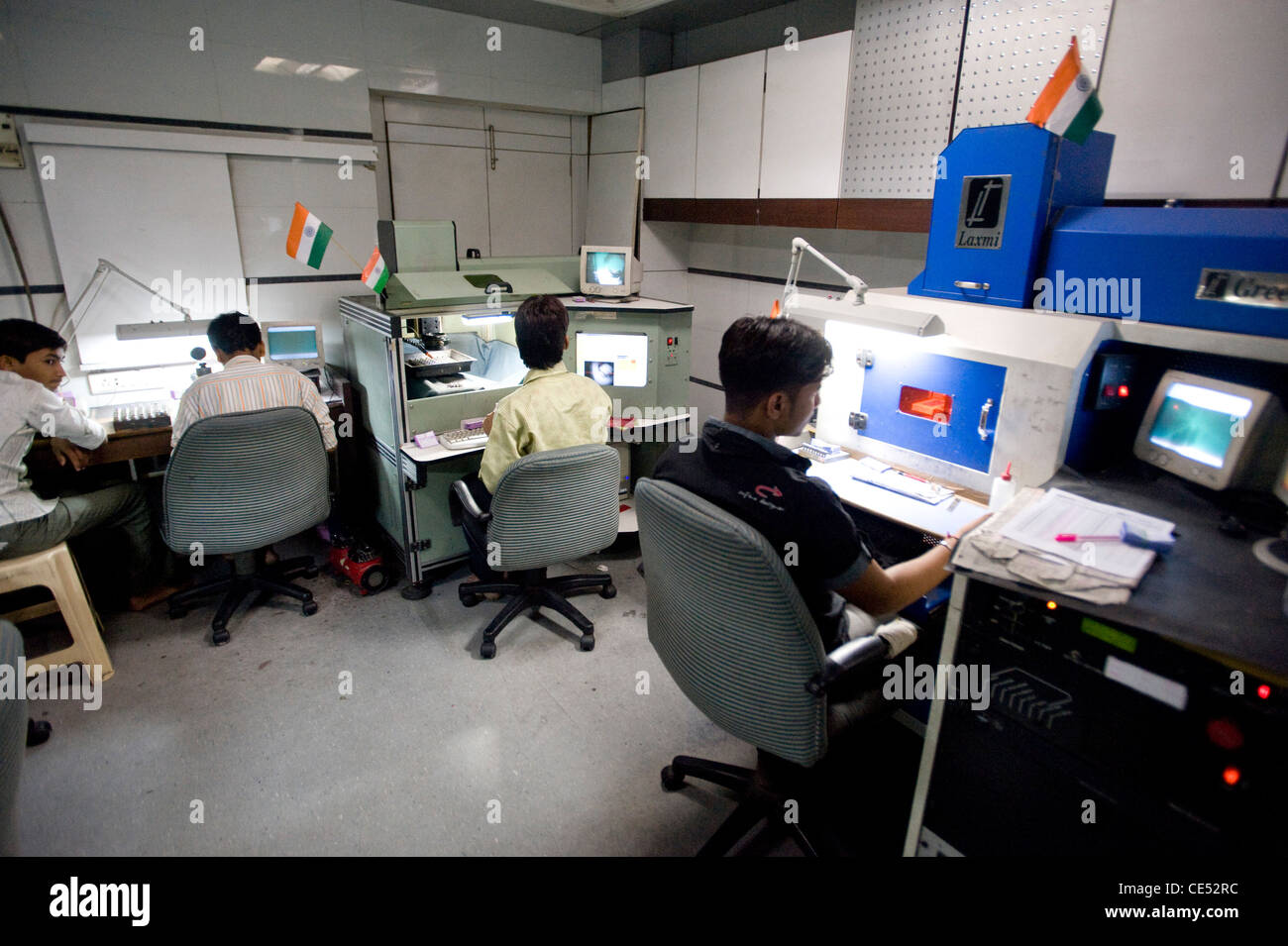 Laser cutting room. Rough diamonds are cut by a laser to make the a 90 ...