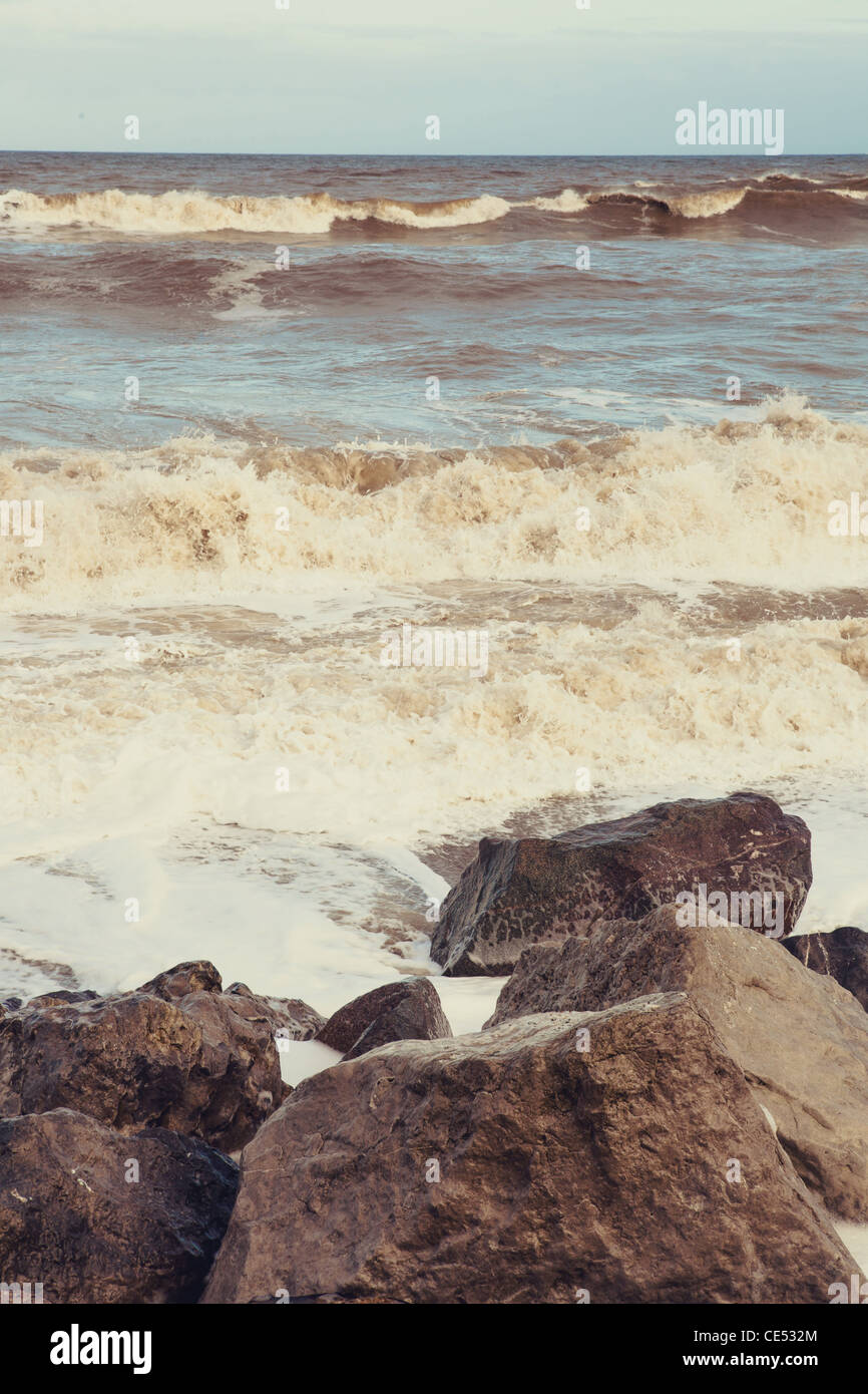 High tide waves at Eccles-on-Sea, Norfolk, UK Stock Photo - Alamy