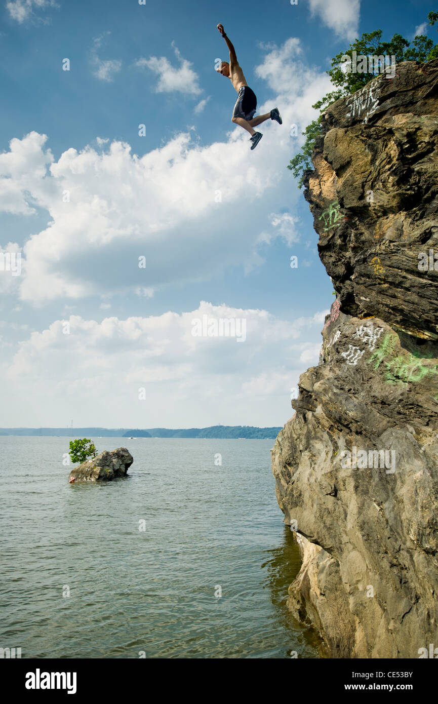 Cliff diver falling into the water in Maryland near Mason Dixon line ...