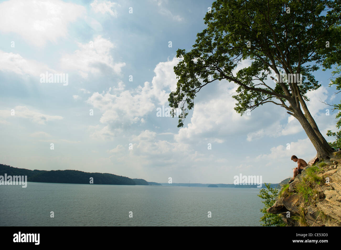 Cliff diver overlooking peak into the water in Maryland near Mason ...