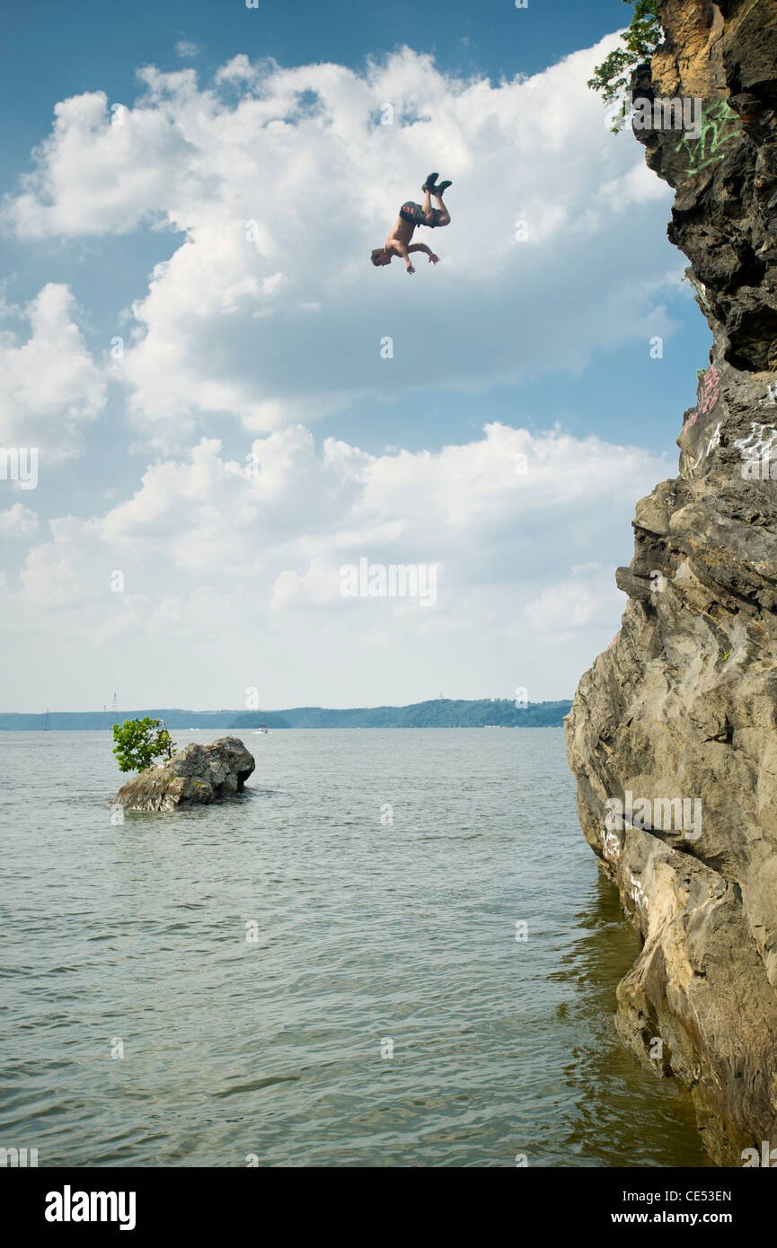 Cliff diver falling into the water in Maryland near Mason Dixon line ...
