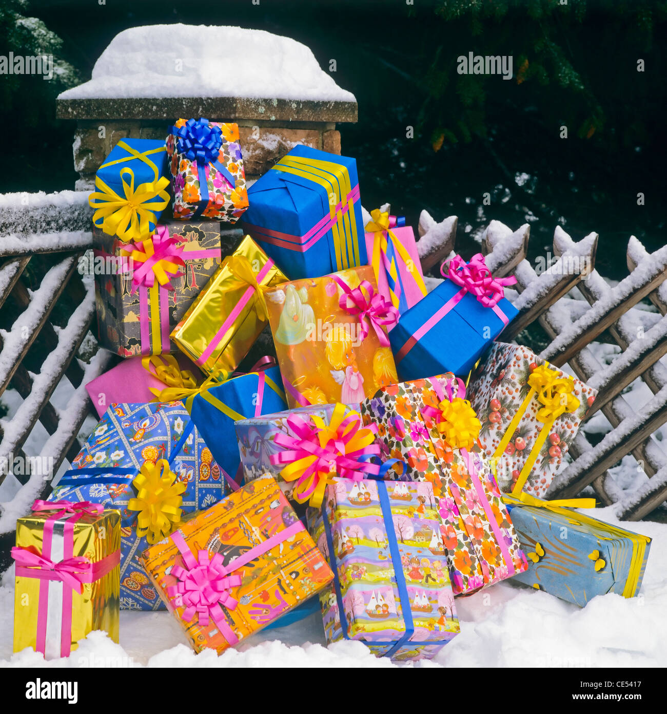 Pile of christmas presents stacked in snow hi-res stock photography and ...