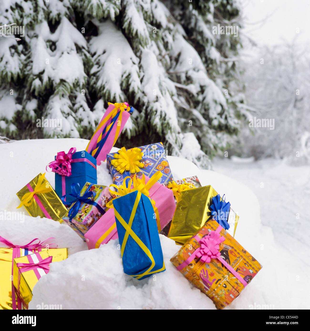 Pile of christmas gifts stacked in snow hi-res stock photography and ...