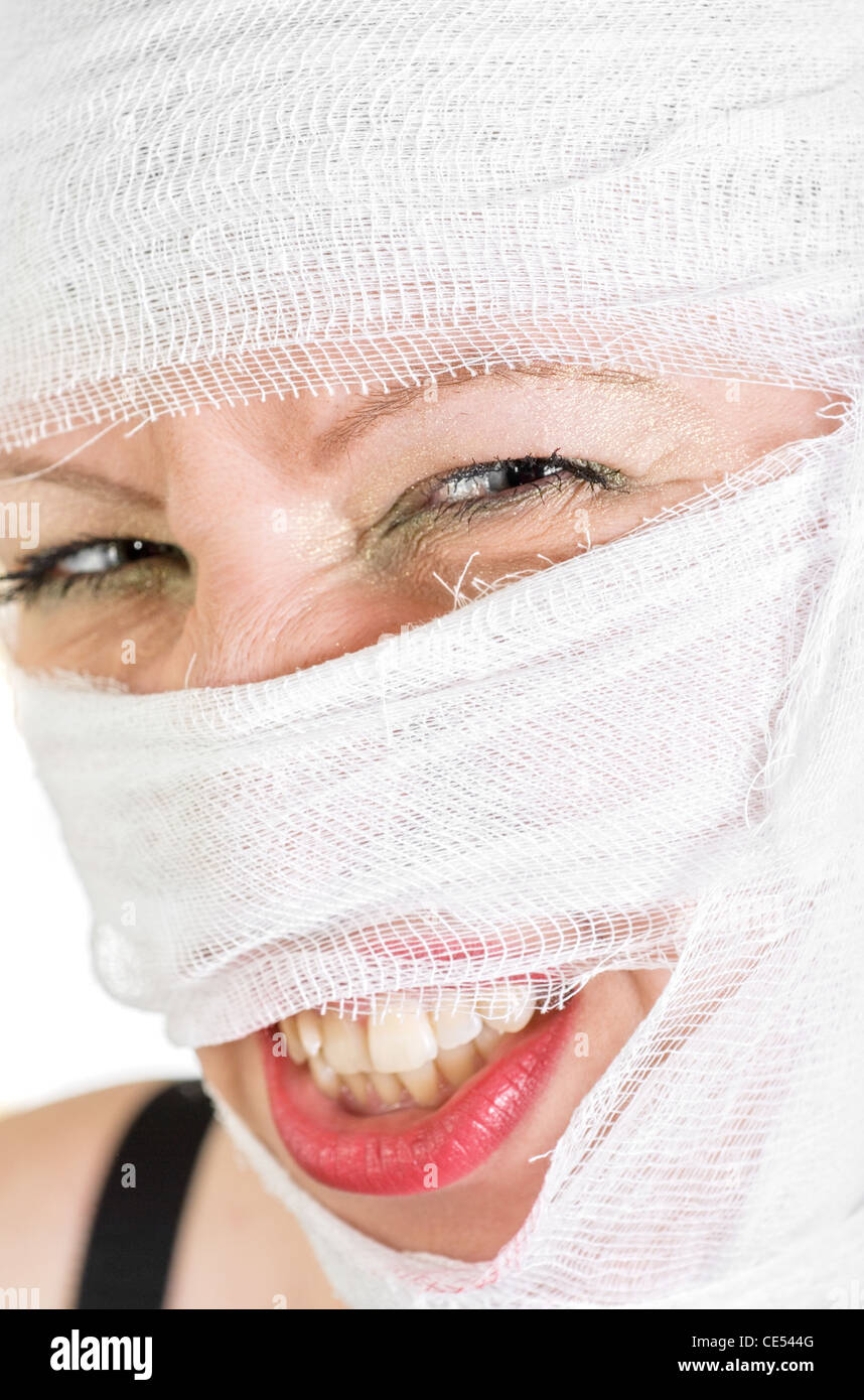 woman with bandages on her face on white Stock Photo - Alamy