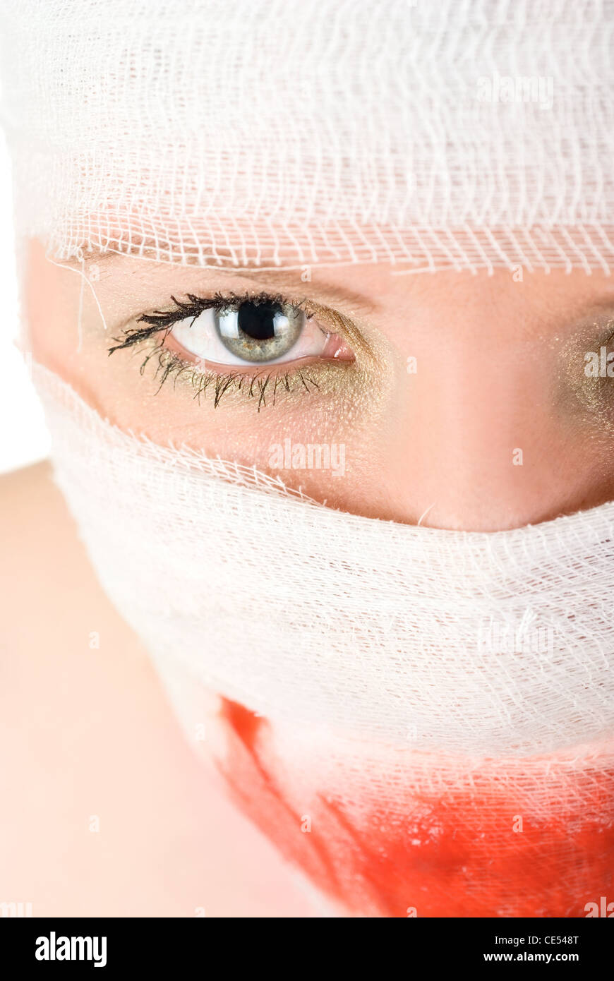 woman with bandages with blood on her face Stock Photo - Alamy