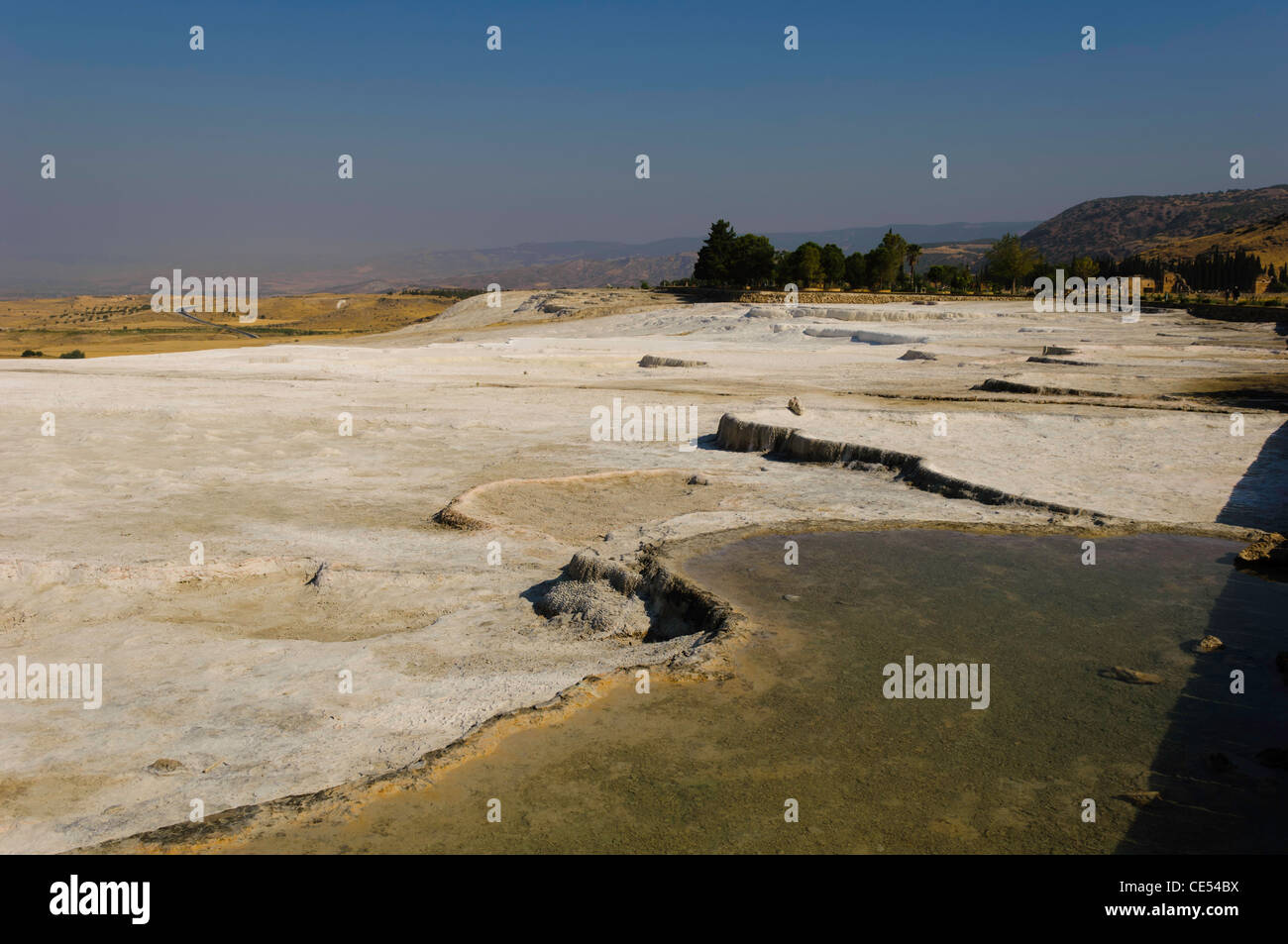 Travertine terraces of calcium carbonate minerals left by flowing water ...