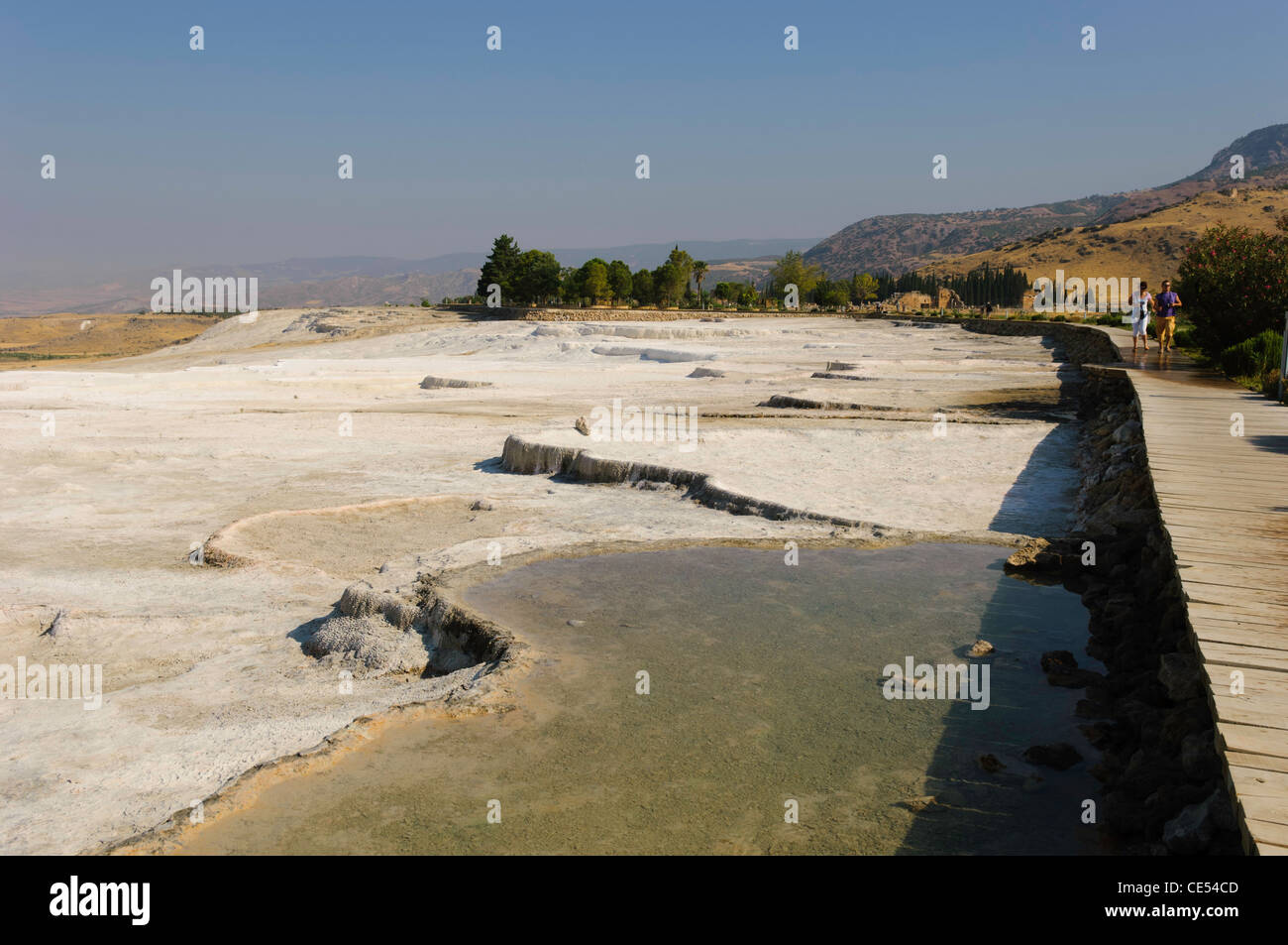 Travertine terraces of calcium carbonate minerals left by flowing water ...