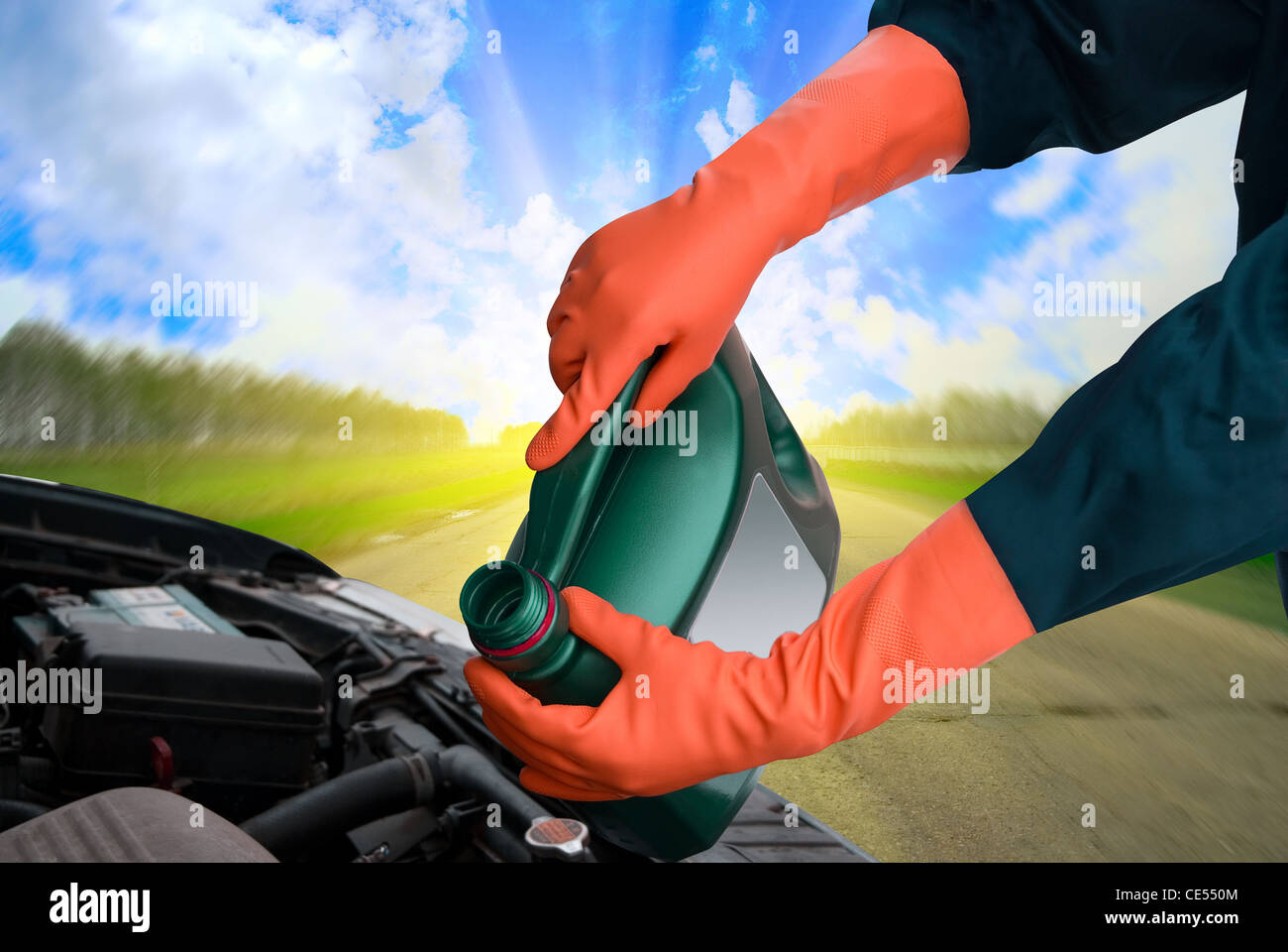 man pours motor oil into the engine Stock Photo - Alamy