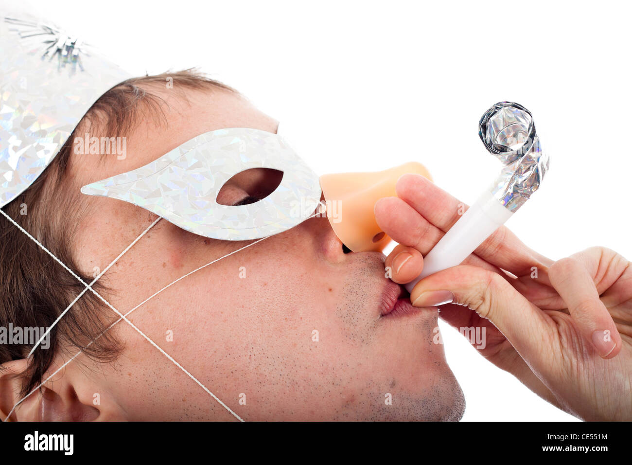 Detail of man face with party mask and party blower, isolated on white ...