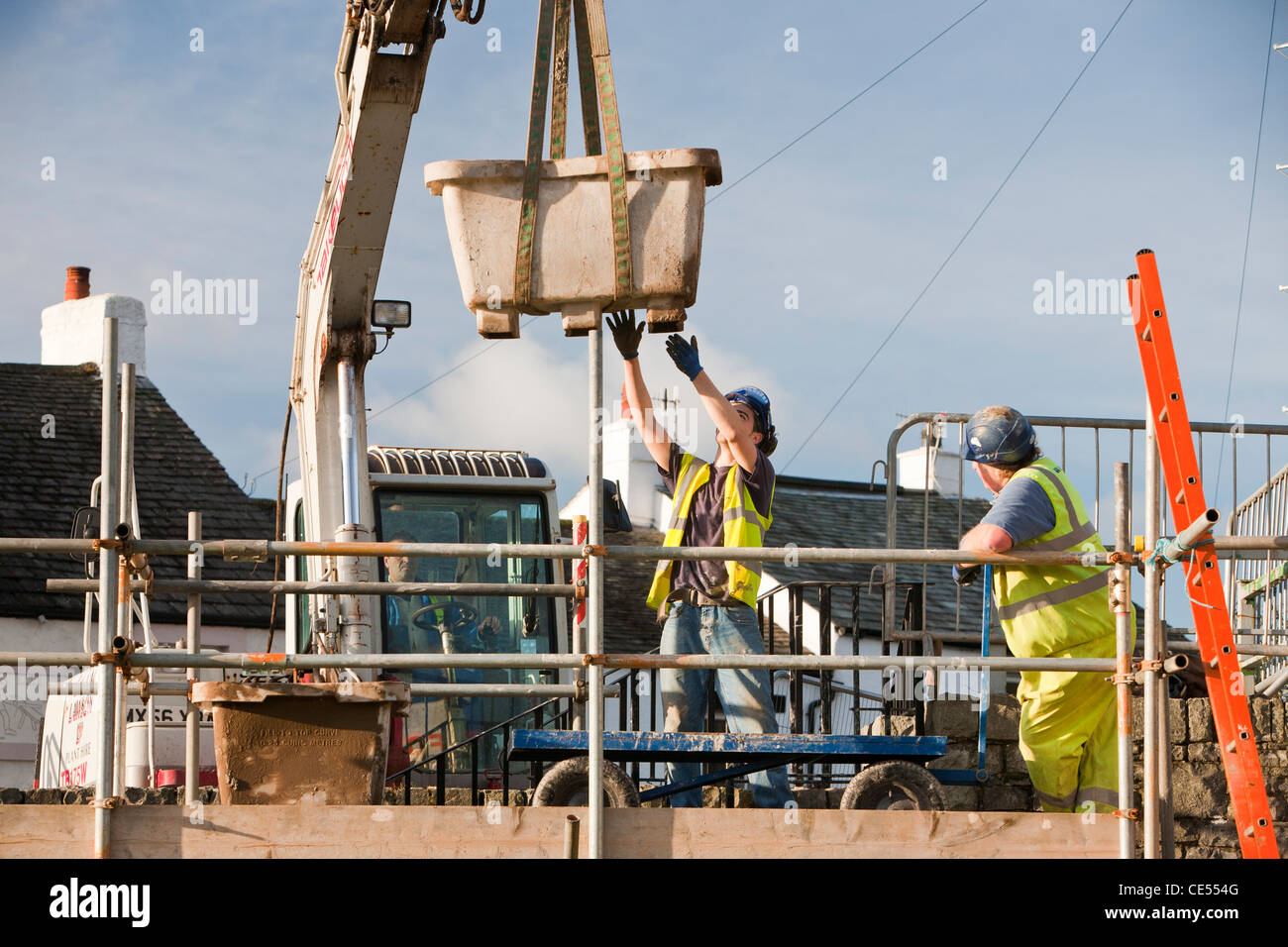 Building flood defences in Keswick Stock Photo - Alamy