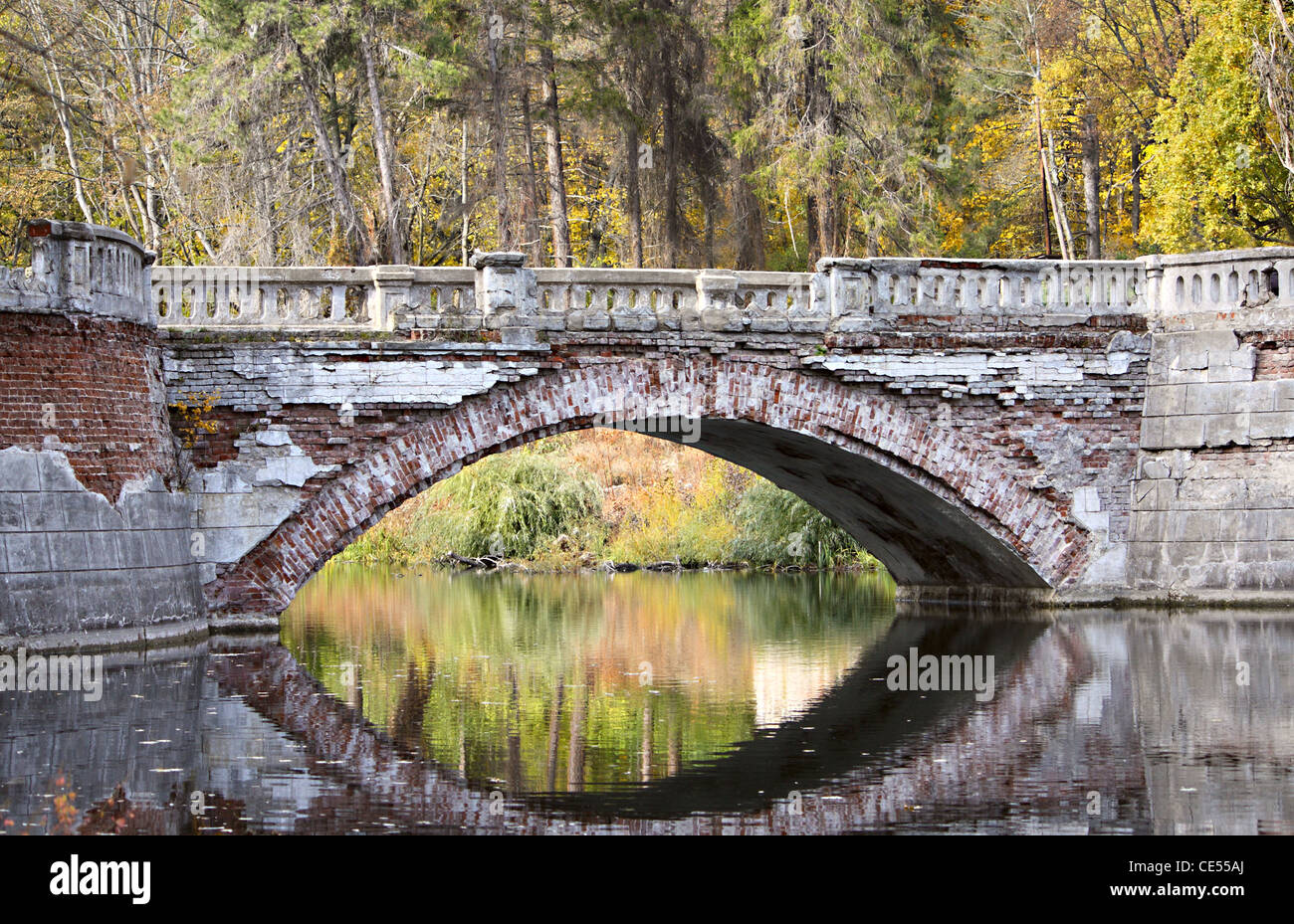 Big obsolete bridge over the river Stock Photo - Alamy