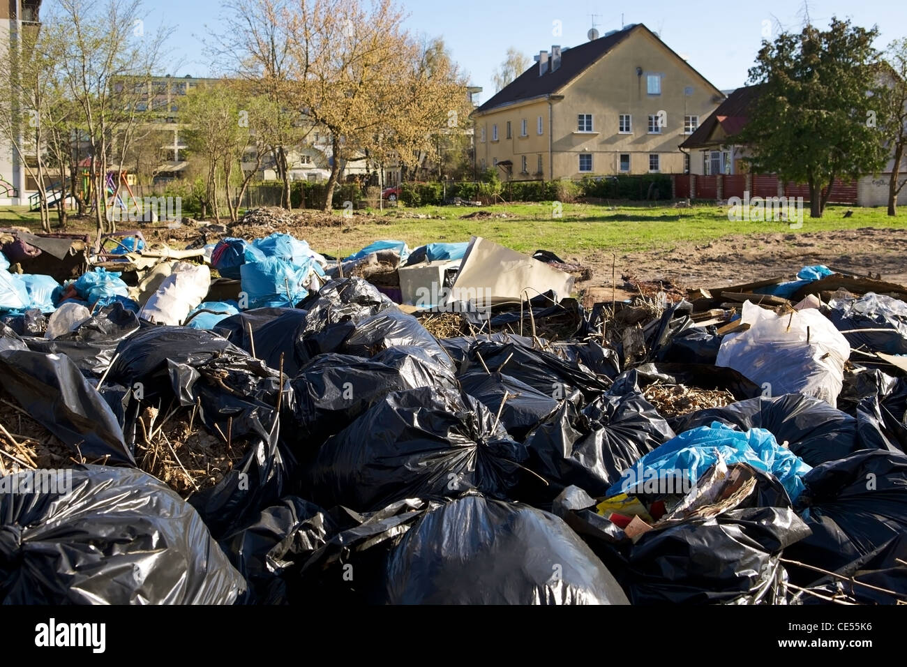Garbage on the houses background Stock Photo - Alamy