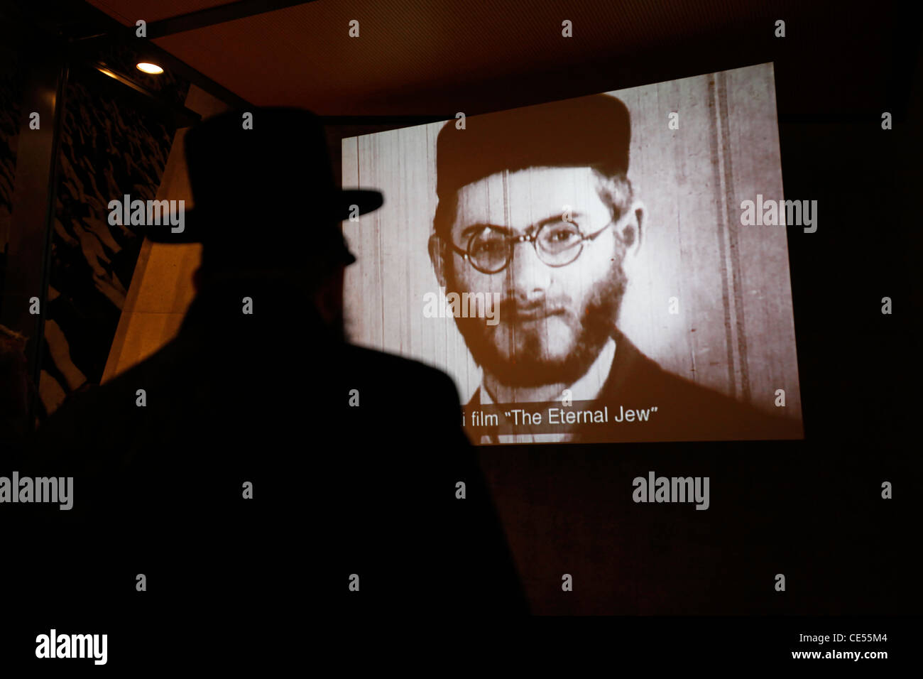 A Haredi Jew watches an anti-Semitic Nazi propaganda film in Yad Vashem ...
