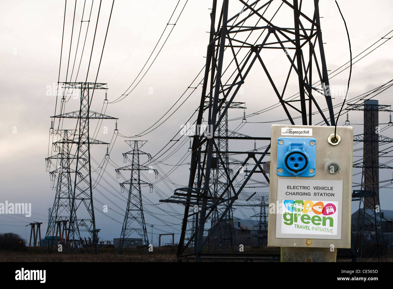 power lines and an electric car recharging station Stock Photo - Alamy