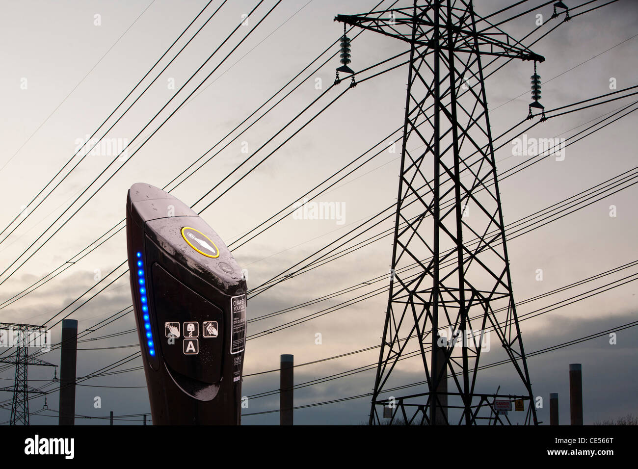 power lines and an electric car recharging station Stock Photo - Alamy