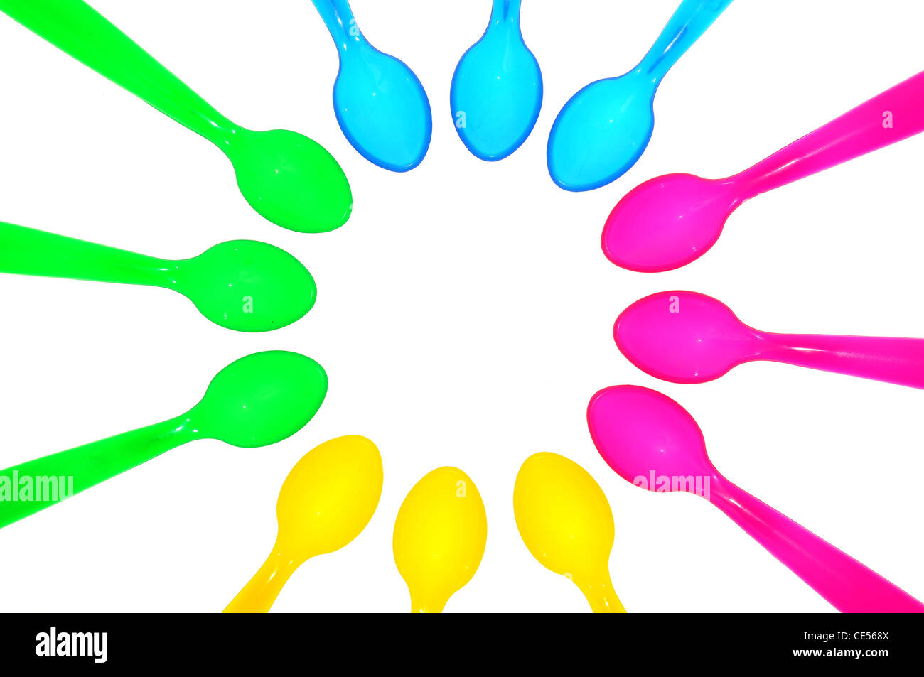 Twelve colorful spoons on a white background Stock Photo - Alamy