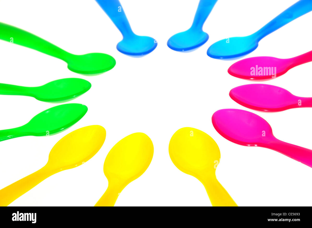 Twelve colorful spoons on a white background Stock Photo - Alamy