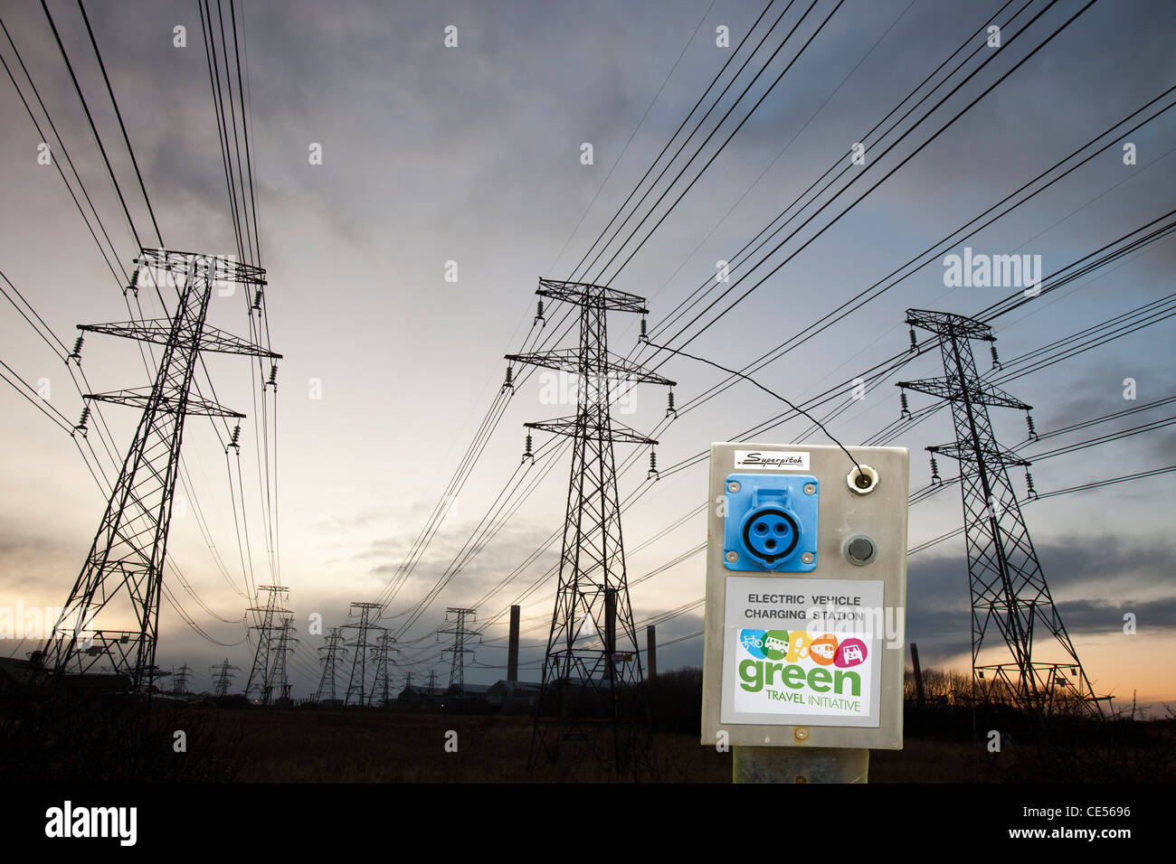 power lines and an electric car recharging station Stock Photo - Alamy