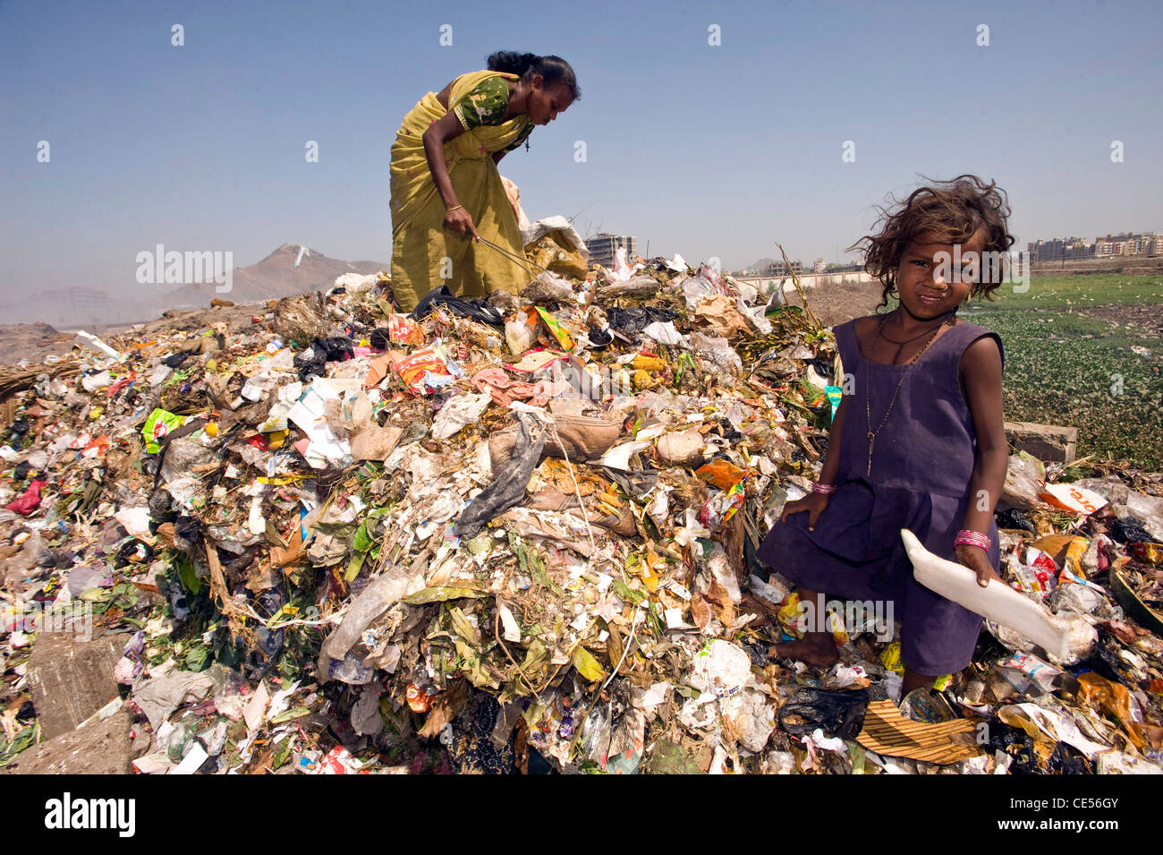 A family of rag pickers pictured on a dump in Virar situated on the ...