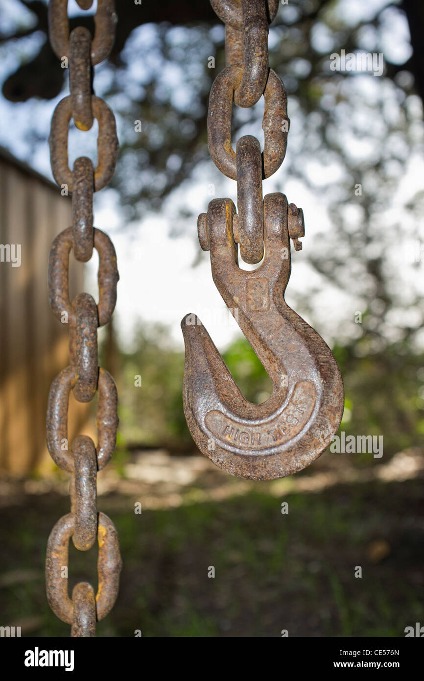 Rusty heavy duty chain with hook attached Stock Photo - Alamy