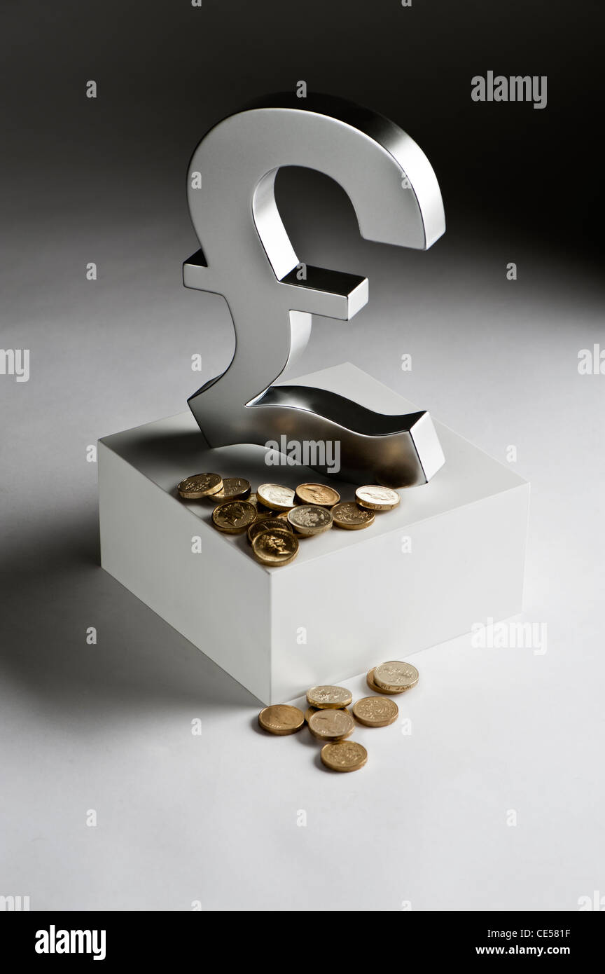sterling symbol with coins on graduated background Stock Photo - Alamy