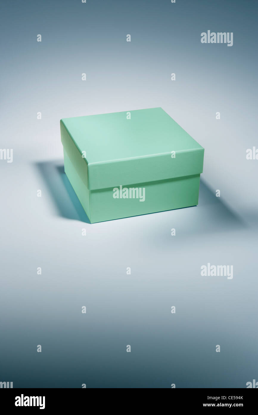 Green Box on blue background Stock Photo - Alamy