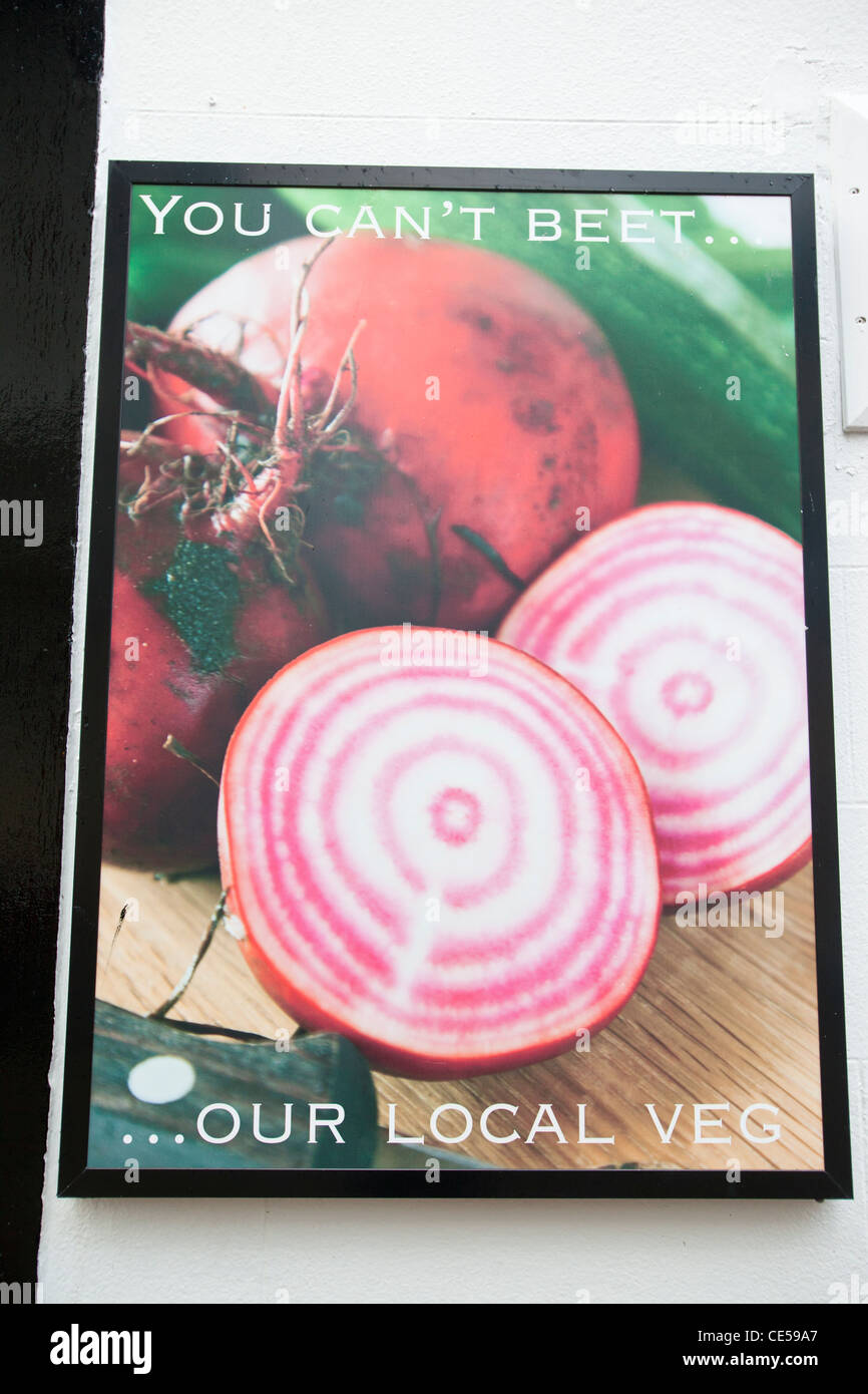 An advert for local food on a pub in Keswick, Cumbria, UK Stock Photo ...