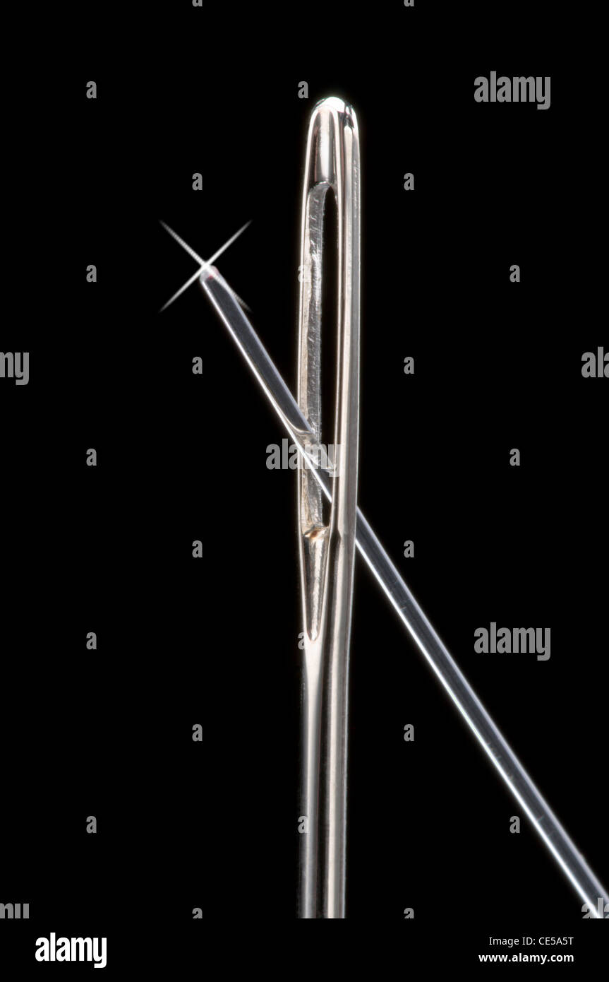 Fiber optic line through sewing needle Stock Photo - Alamy
