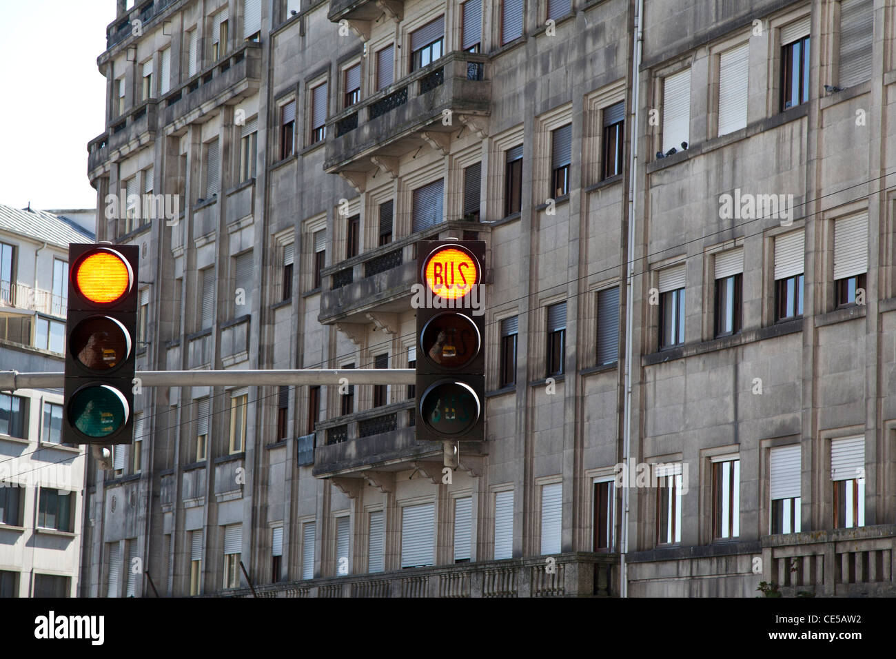 Orange bus traffic lights Stock Photo - Alamy