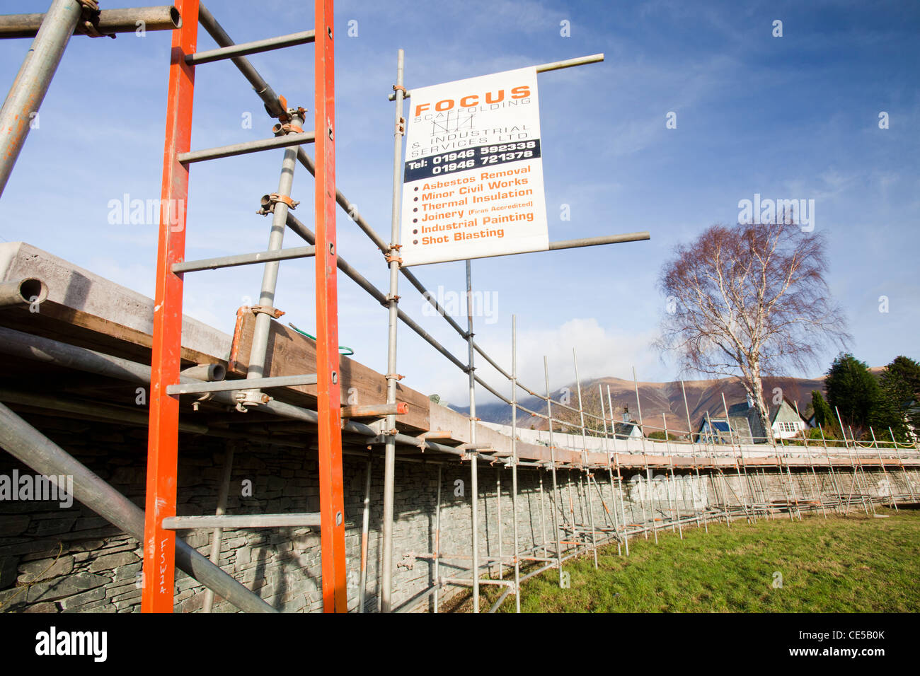 Building flood defences in Keswick Stock Photo - Alamy