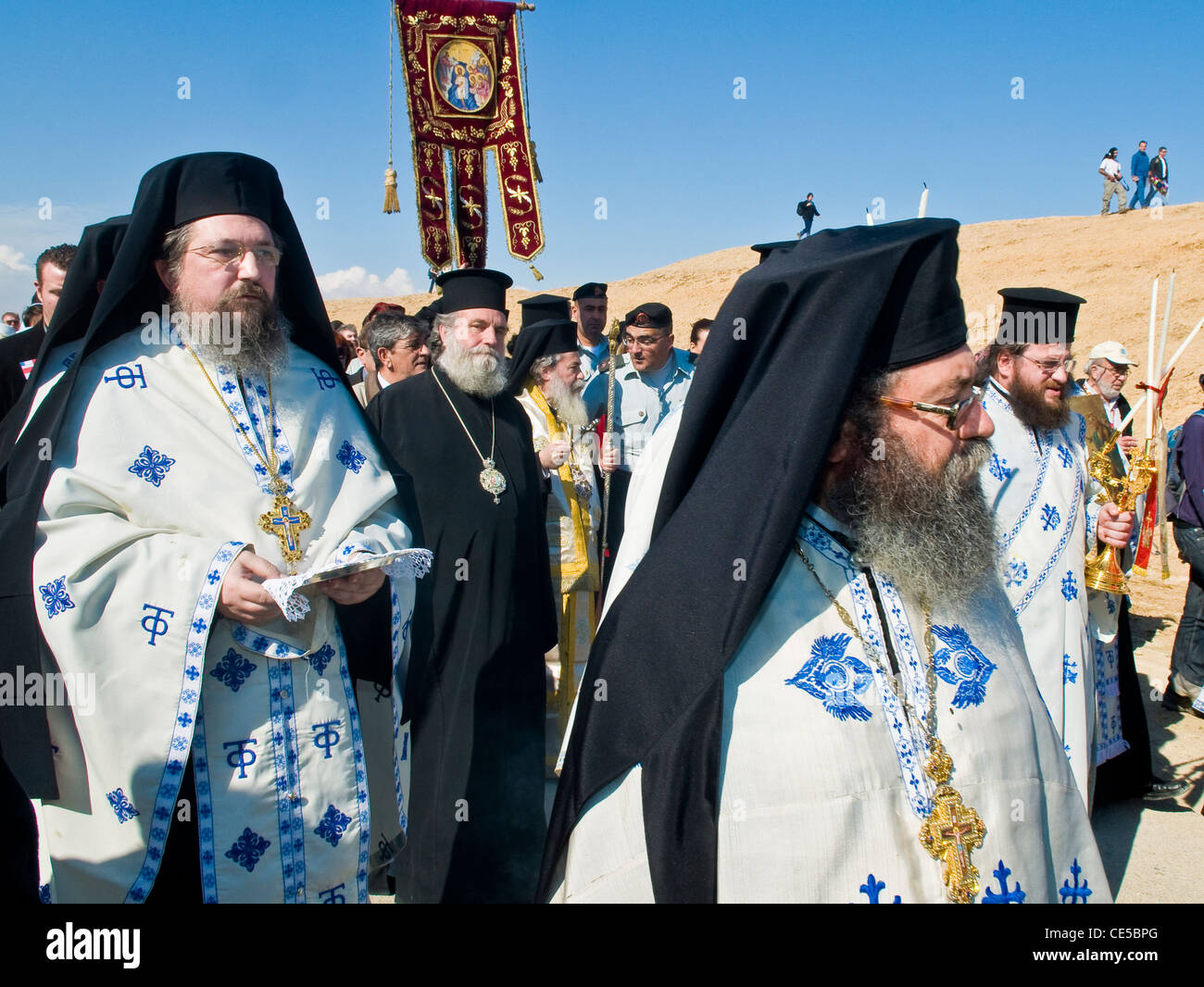The Greek orthodox patriarch participates in the baptizing ritual ...