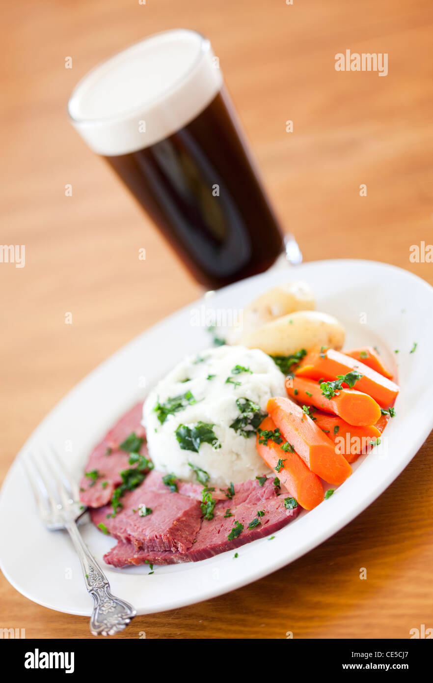 Traditional Corned Beef Dinner with Beer on a table Stock Photo - Alamy