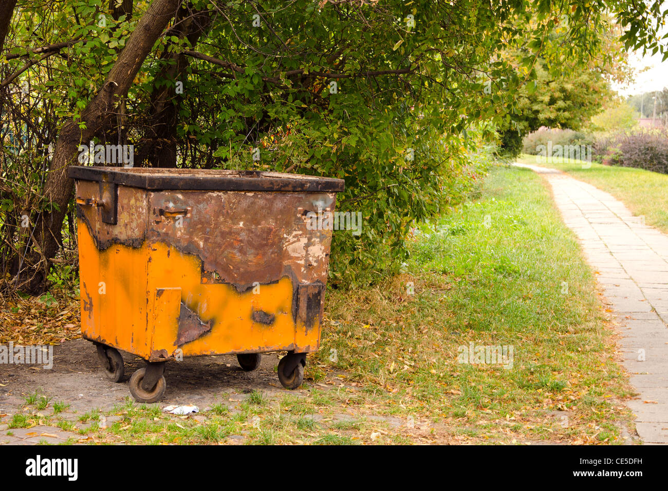 vintage and rusty dustbin in the city park Stock Photo - Alamy
