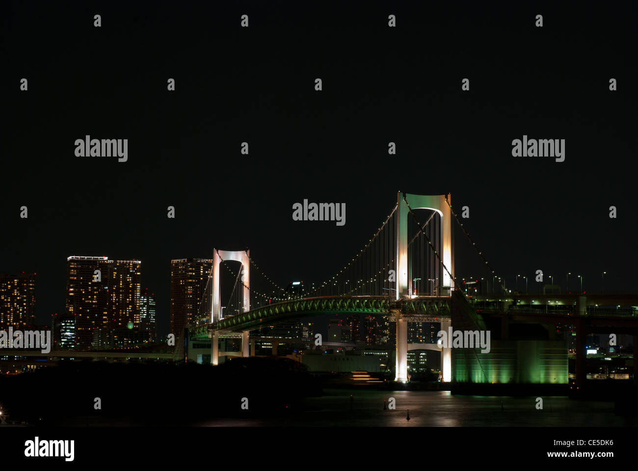 the beautiful night skyline with Rainbow Bridge the famous bridge in ...