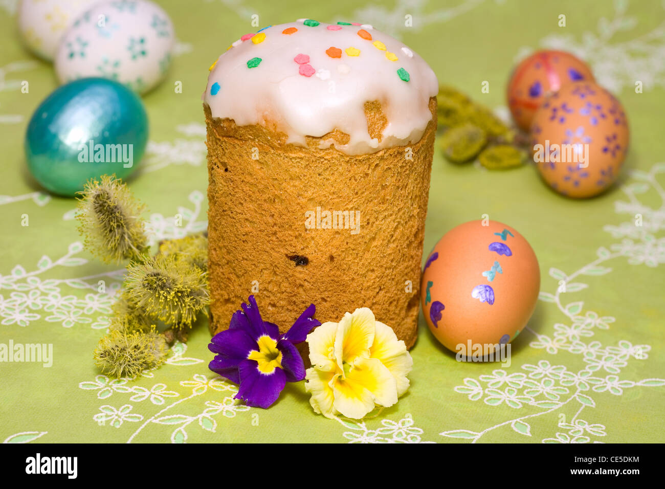 Easter cake with glace icing and colored easter eggs Stock Photo - Alamy