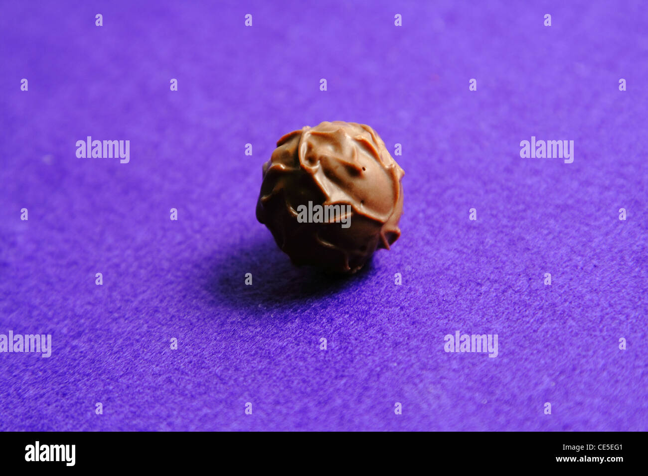 Fancy globe chocolate over a violet background with interesting ...