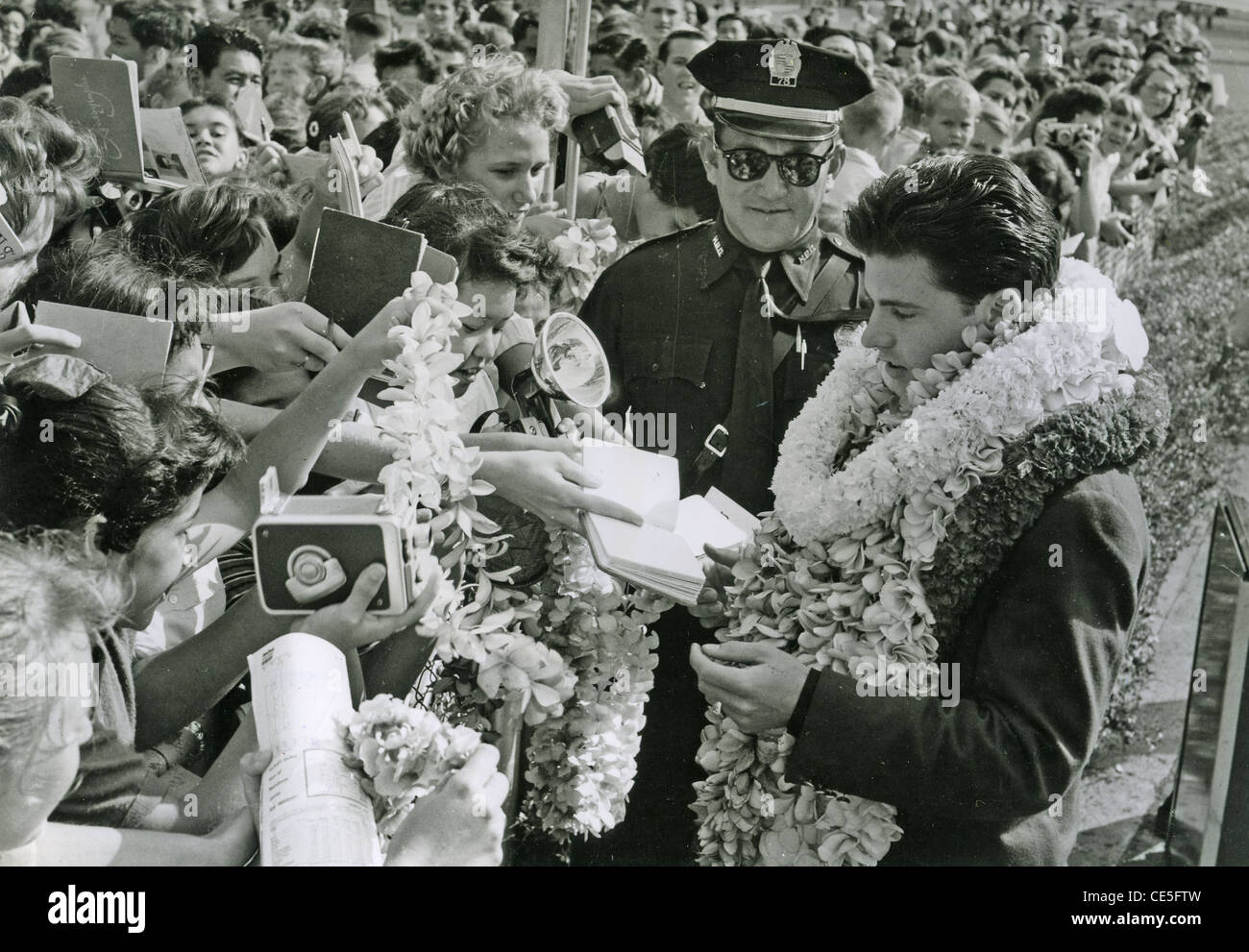 RICKY NELSON US pop singer signs for fans about 1964 Stock Photo - Alamy