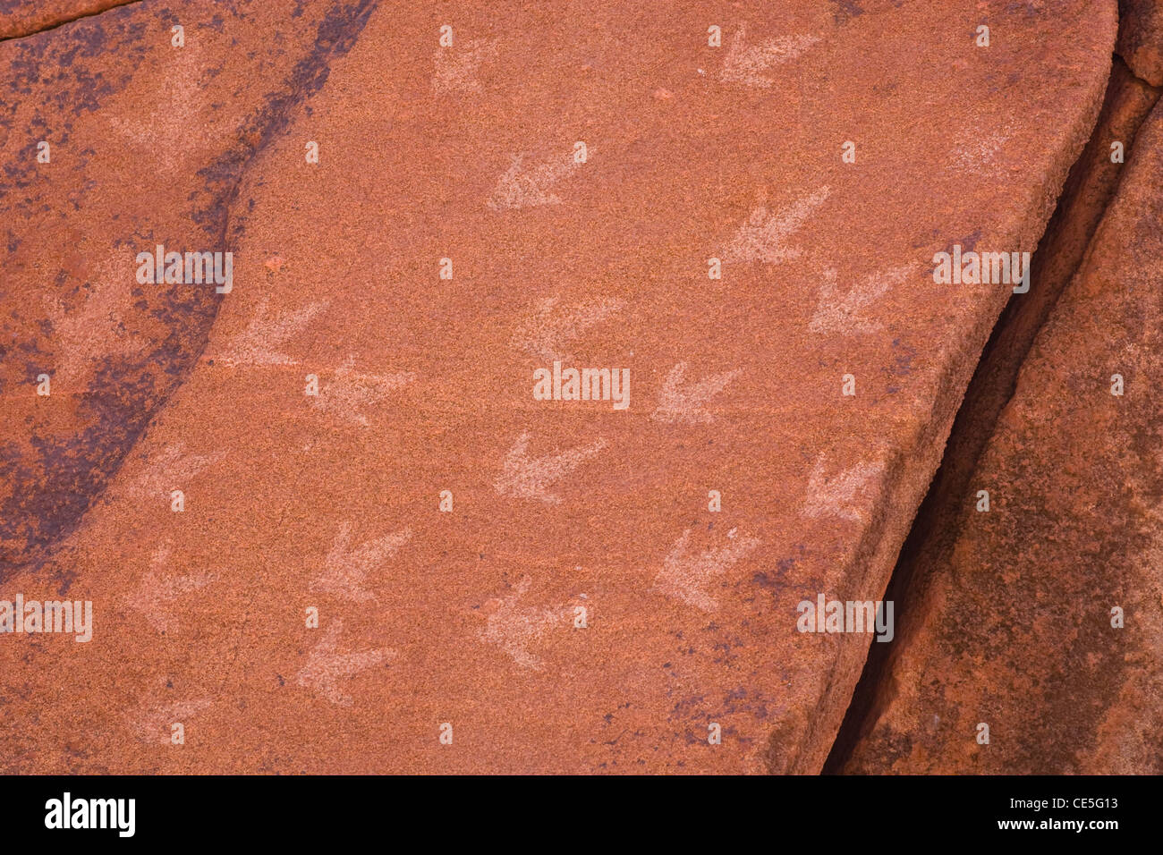 Aboriginal carving of emu tracks in rock on the Burrup Peninsula near ...