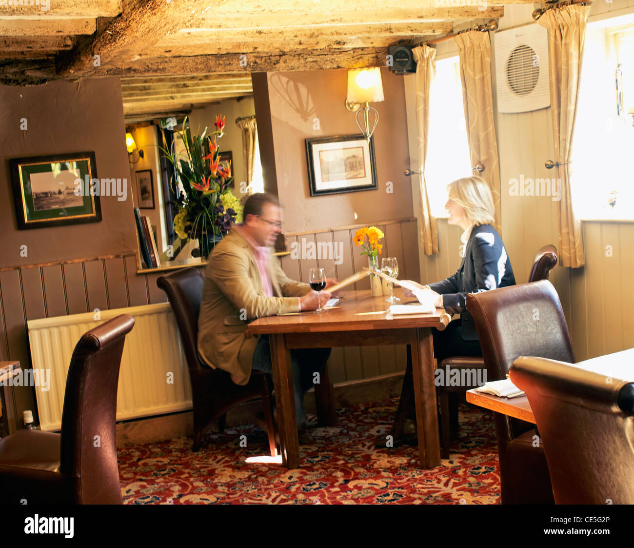 a couple read restaurant menus Stock Photo - Alamy