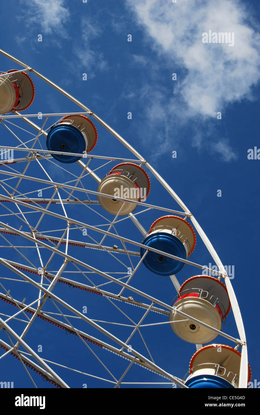 multicoloured ferris wheel, blue sky Stock Photo - Alamy