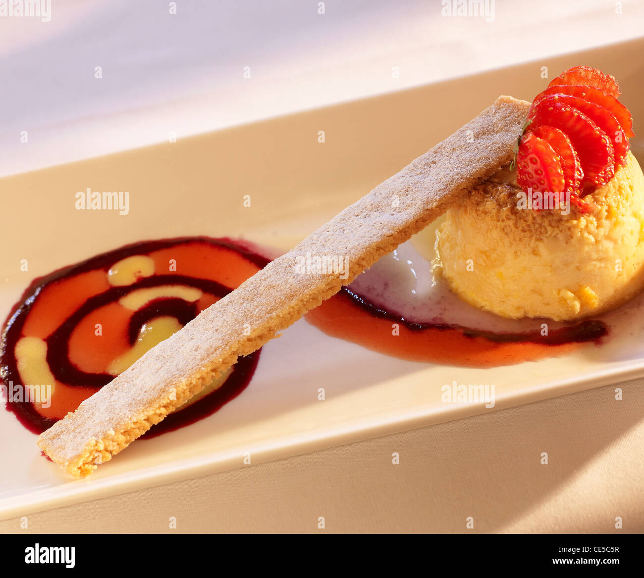 creme brulee with shortbread and strawberry Stock Photo - Alamy