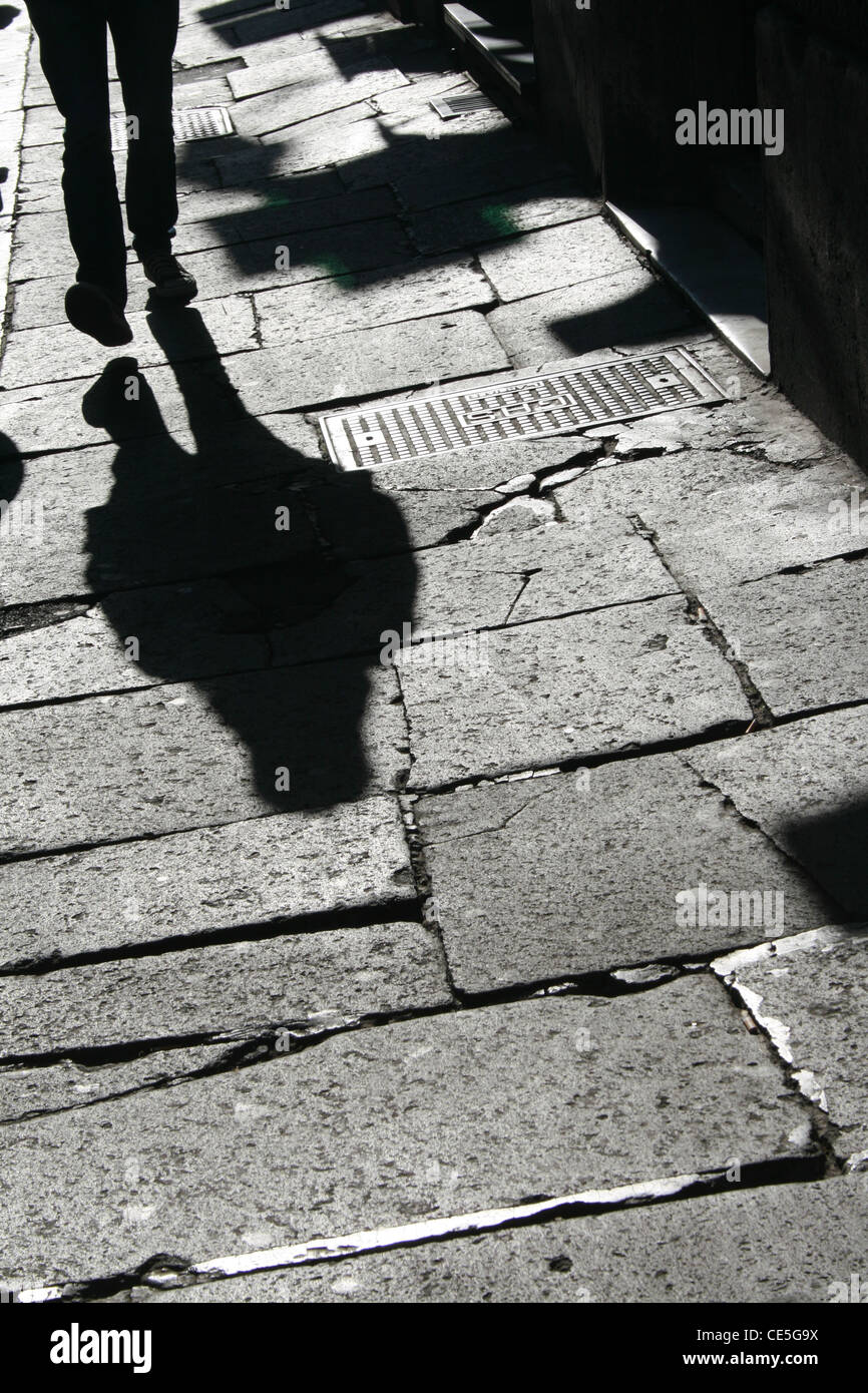 one person walking in empty street road in city town Stock Photo - Alamy