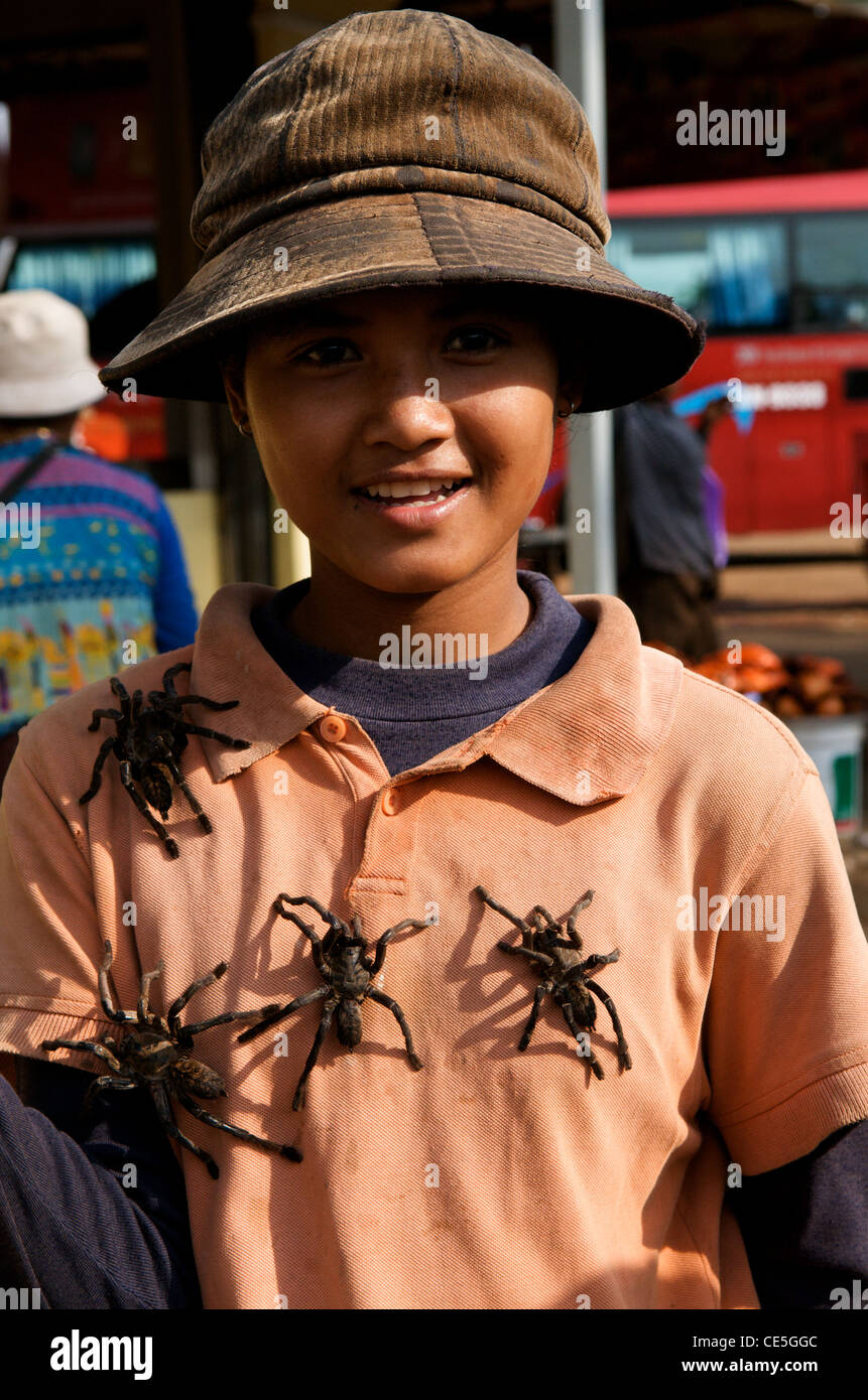 Live tarantulas on Khmer girl's shirt, Fried spider is a regional ...